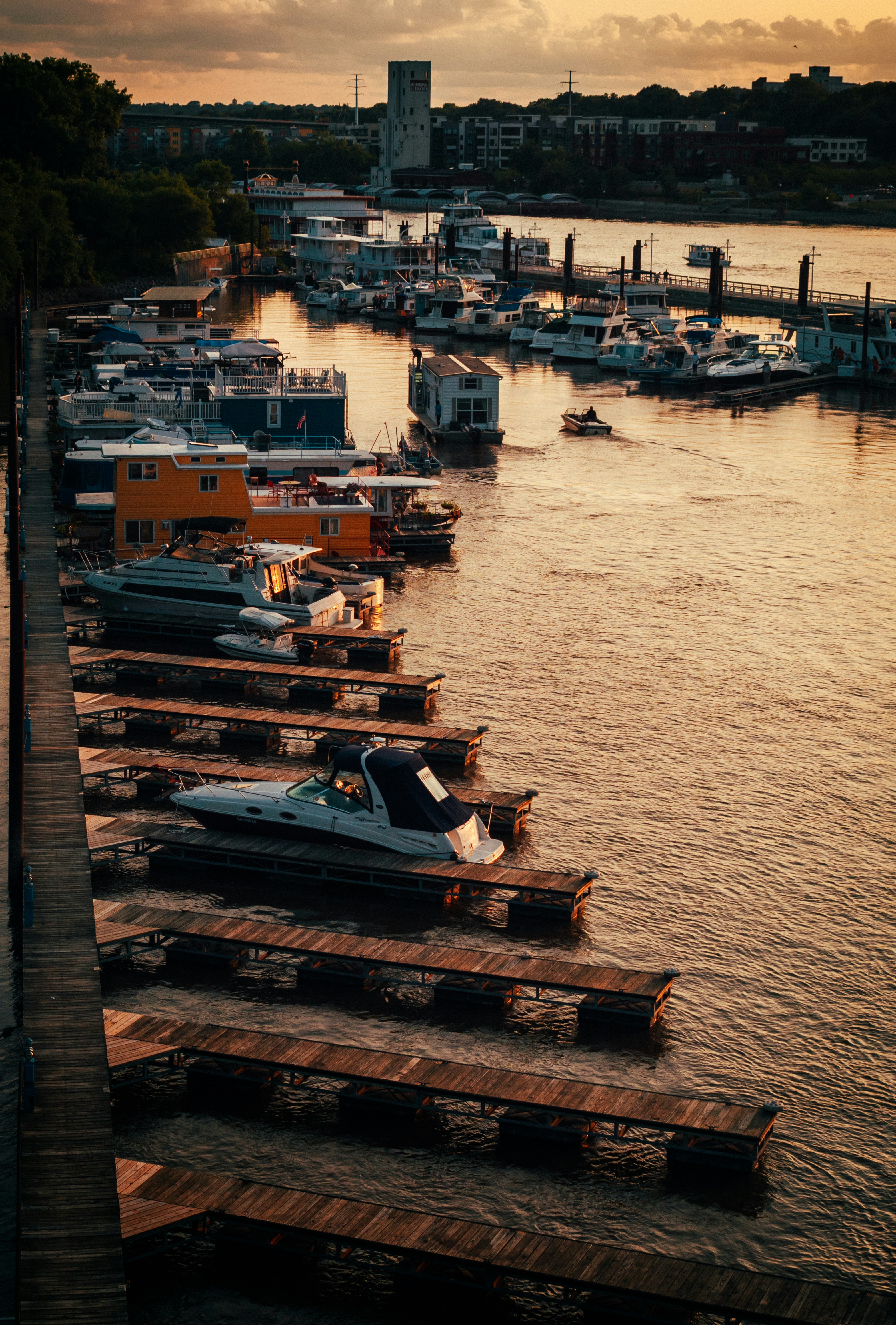 Golden Hour on the Docks: Boats Rest Along Weathered Piers at Sunset