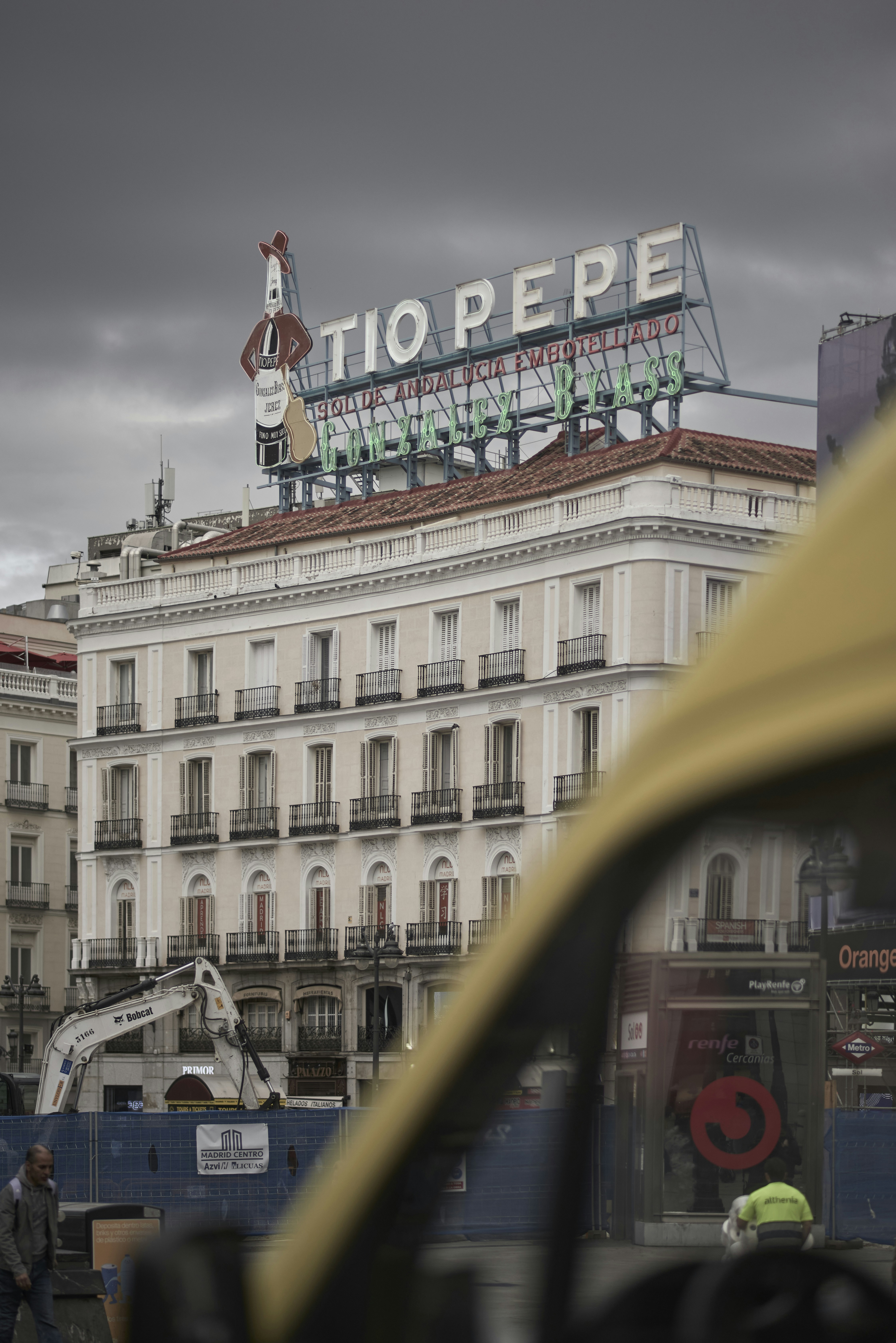 Tio Pepe Neon Sign Over a Neoclassical City Block in Overcast Light