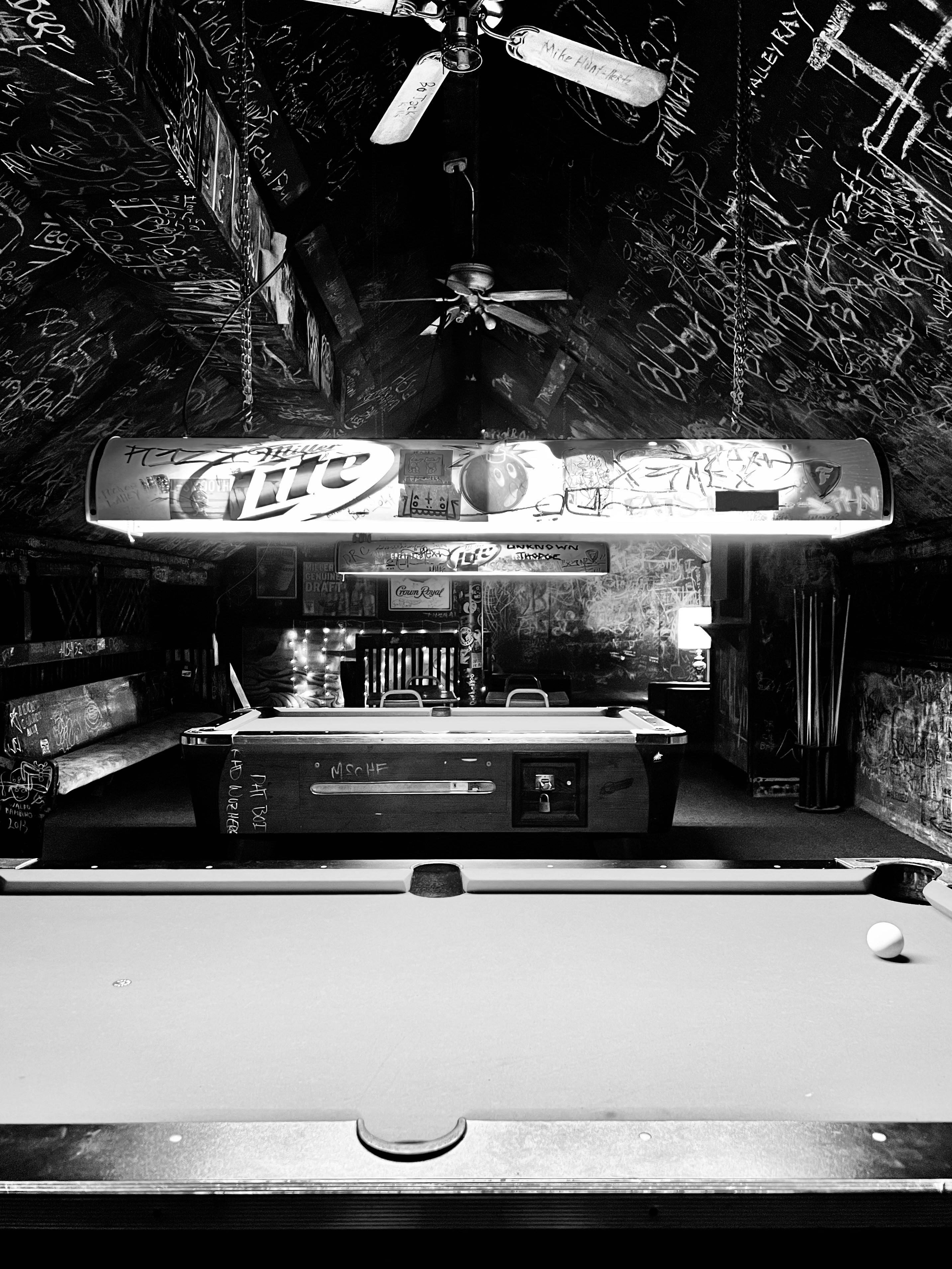 A pool table in a room with graffiti on the walls photo – Free The ...