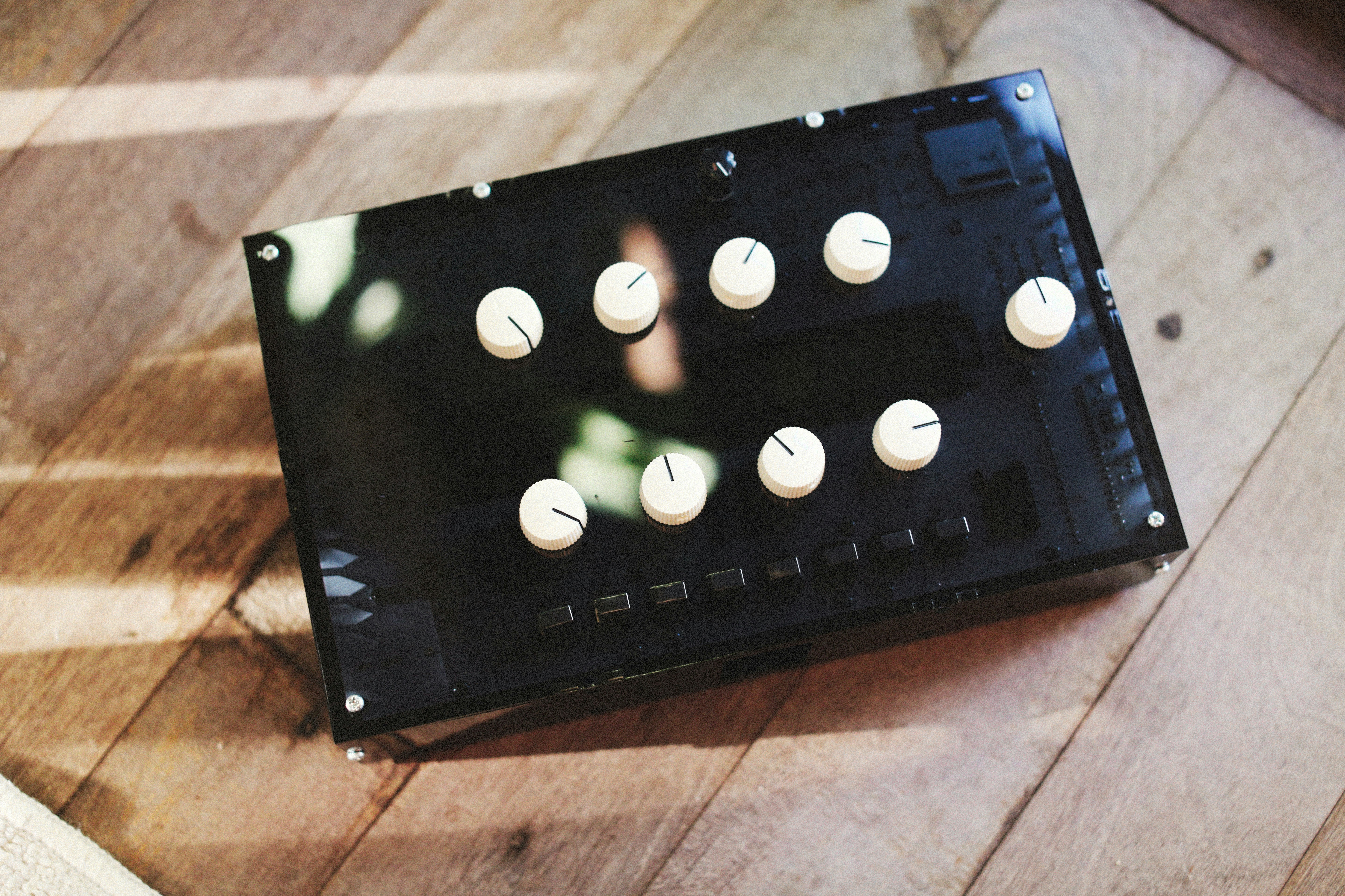 Knobbed Control Rack on a Weathered Wooden Floor