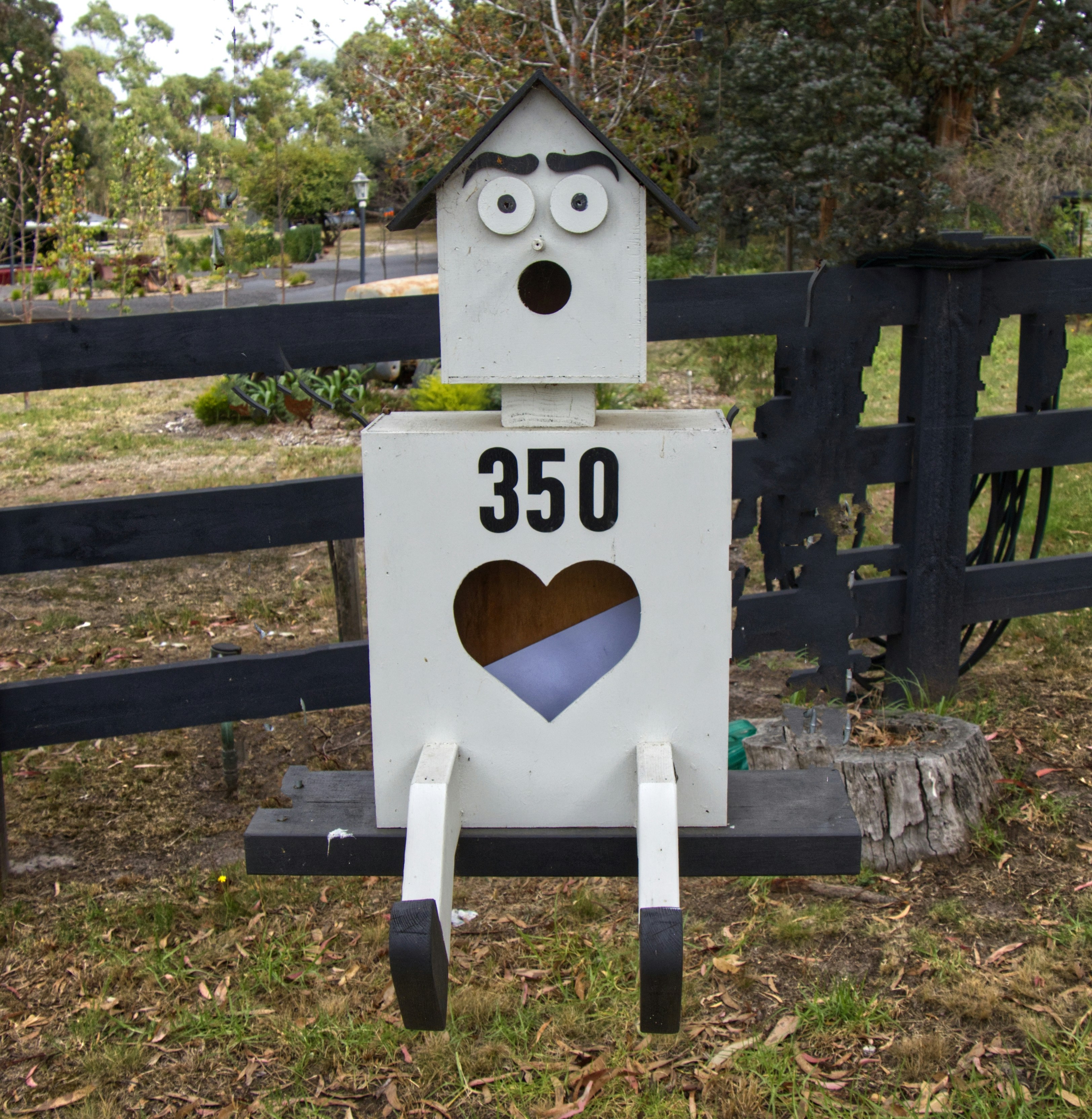 A mailbox with a face and a heart painted on it photo – Free Grey Image ...