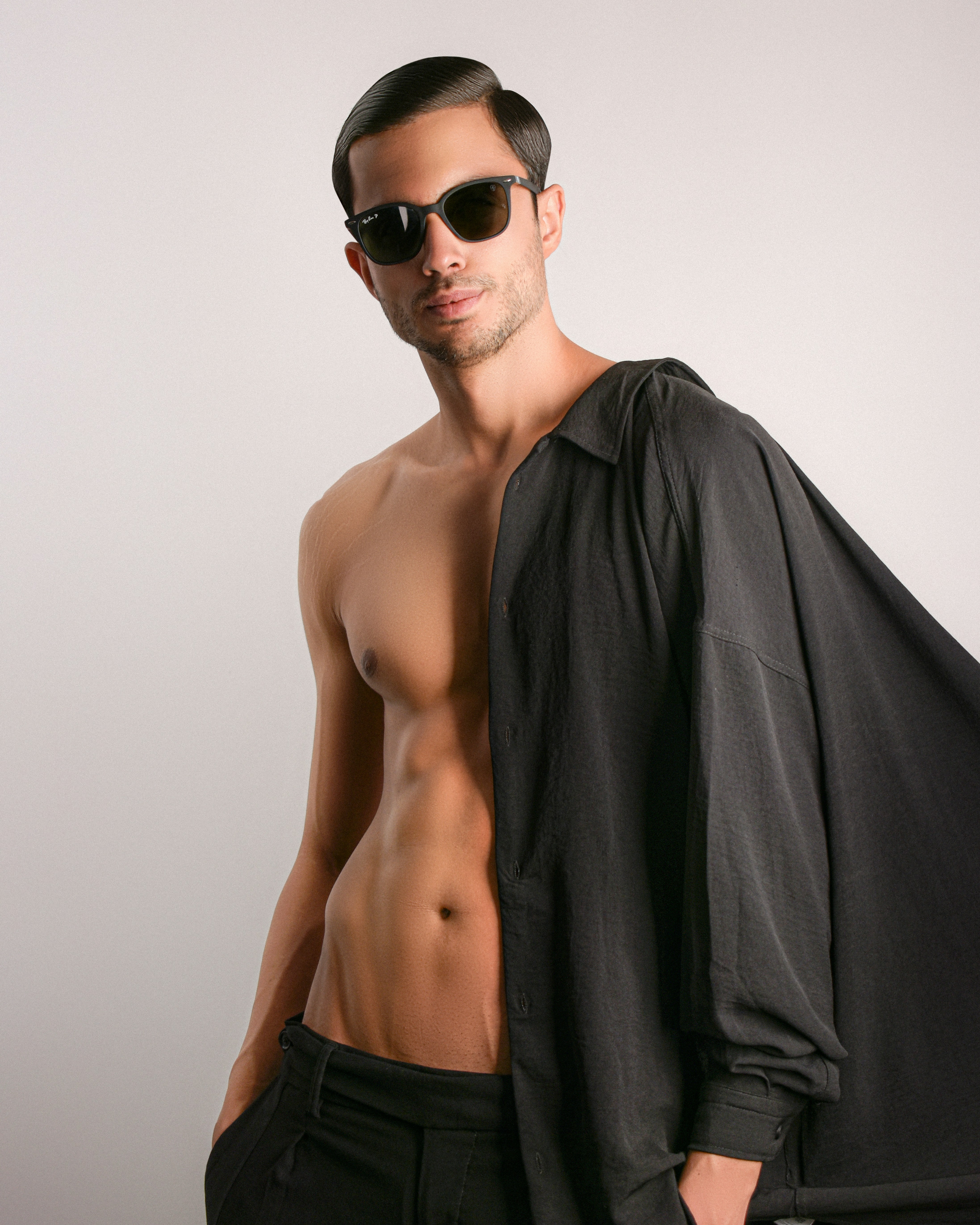 Chiaroscuro Swagger: A Half-Draped Silhouette Under Studio Light