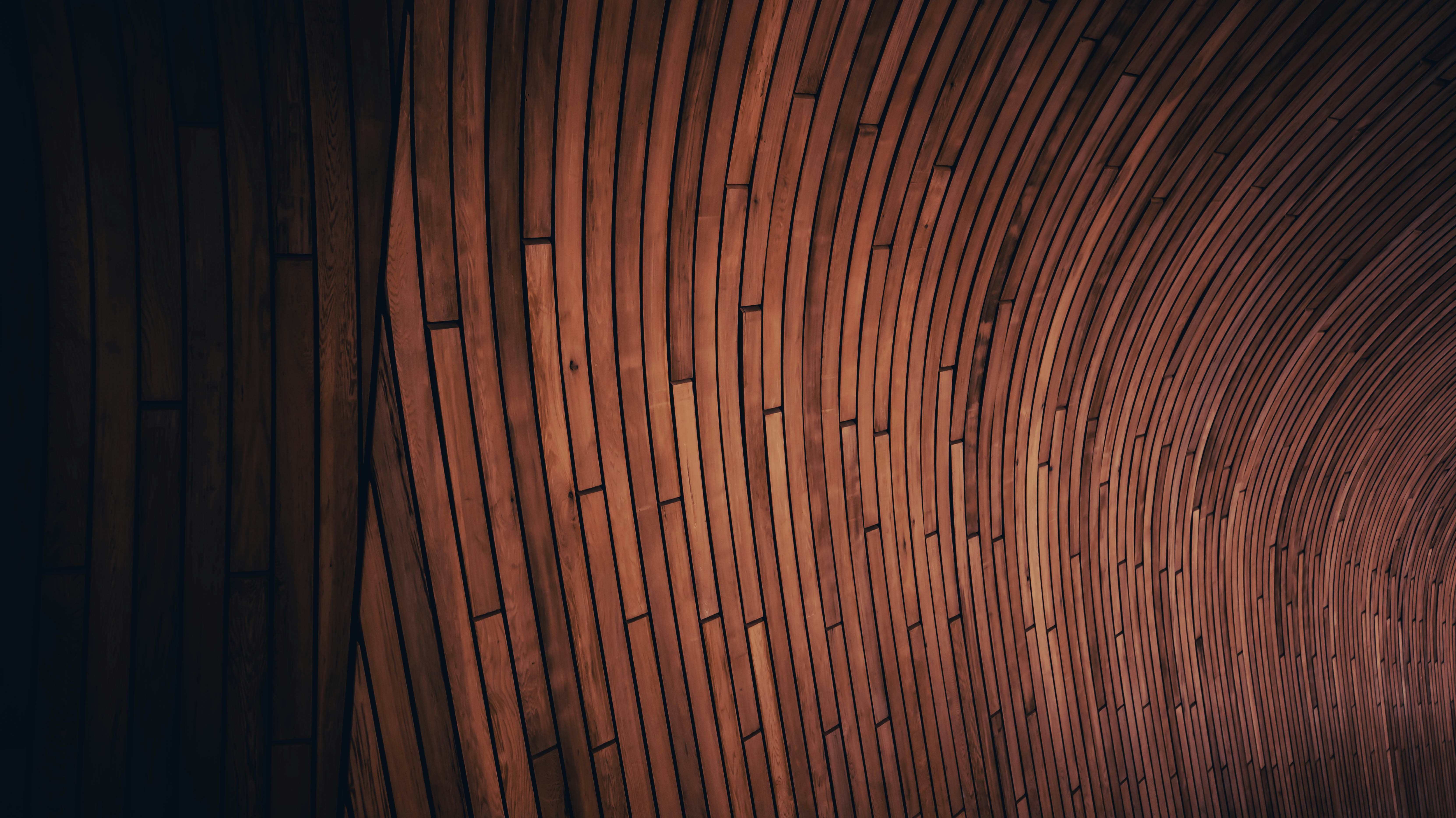 a close up of a wooden structure with a light at the end