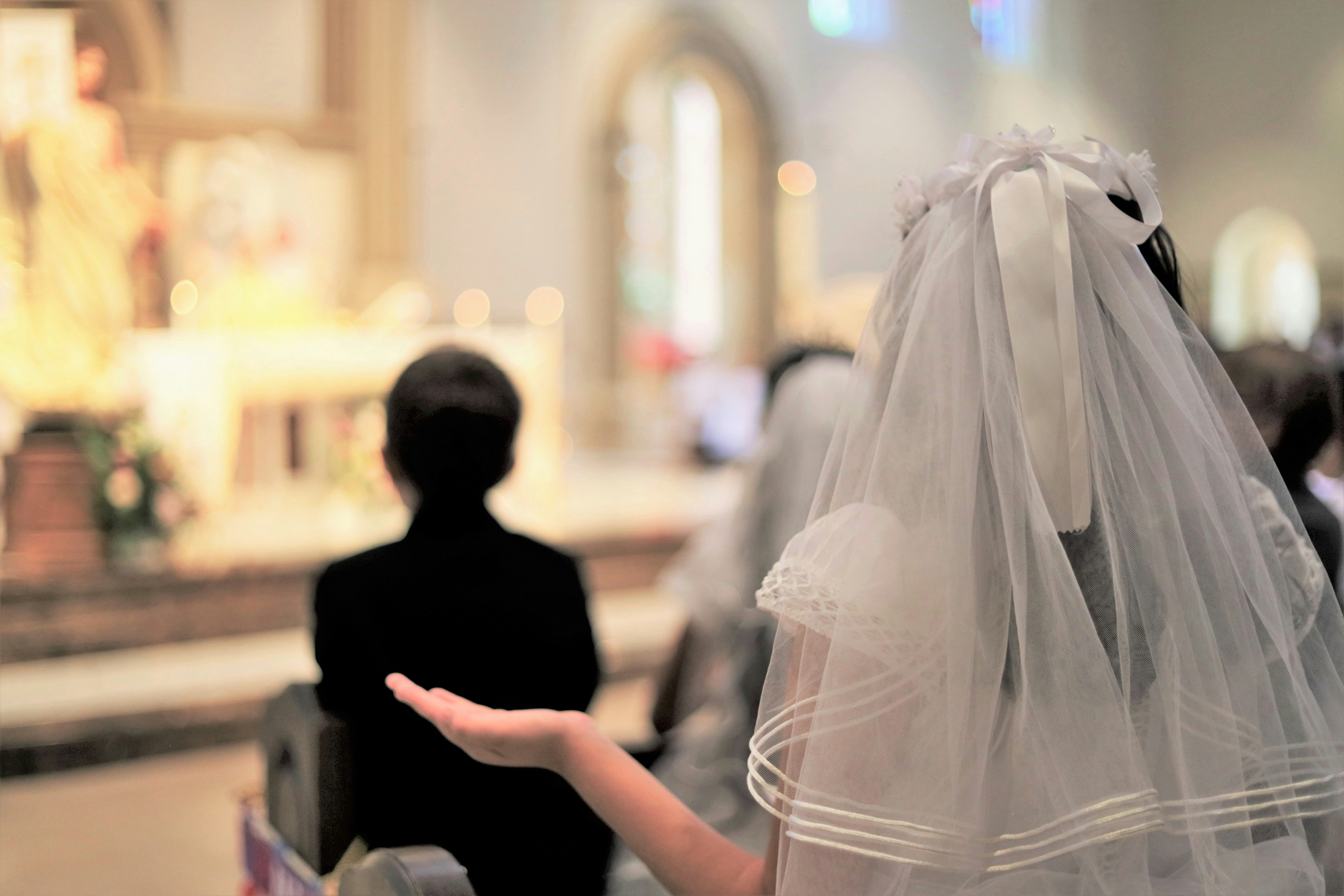 A person in a church with a veil over their head photo – Free Clothing ...
