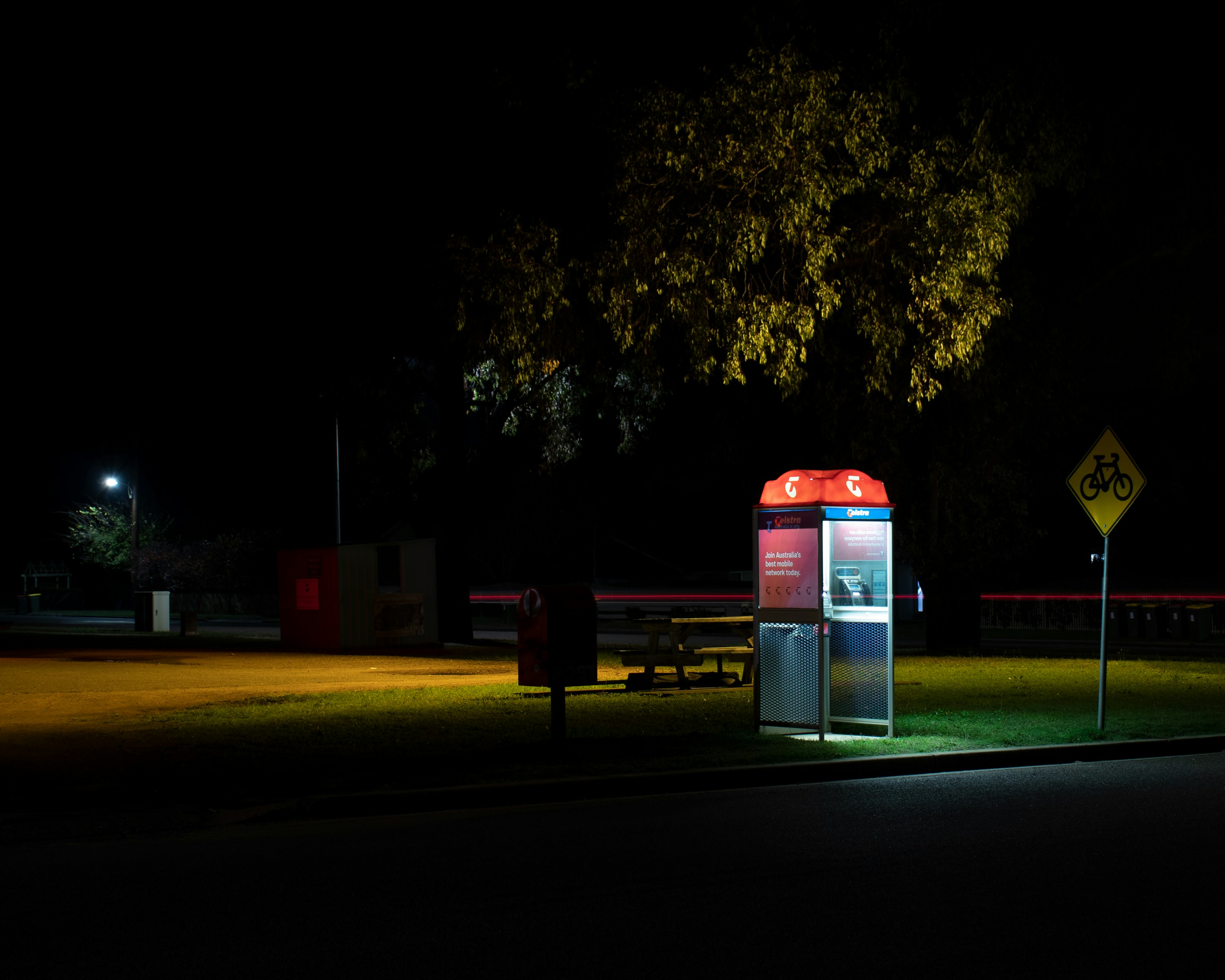 Illuminated Solitude: A Night at the Phone Booth