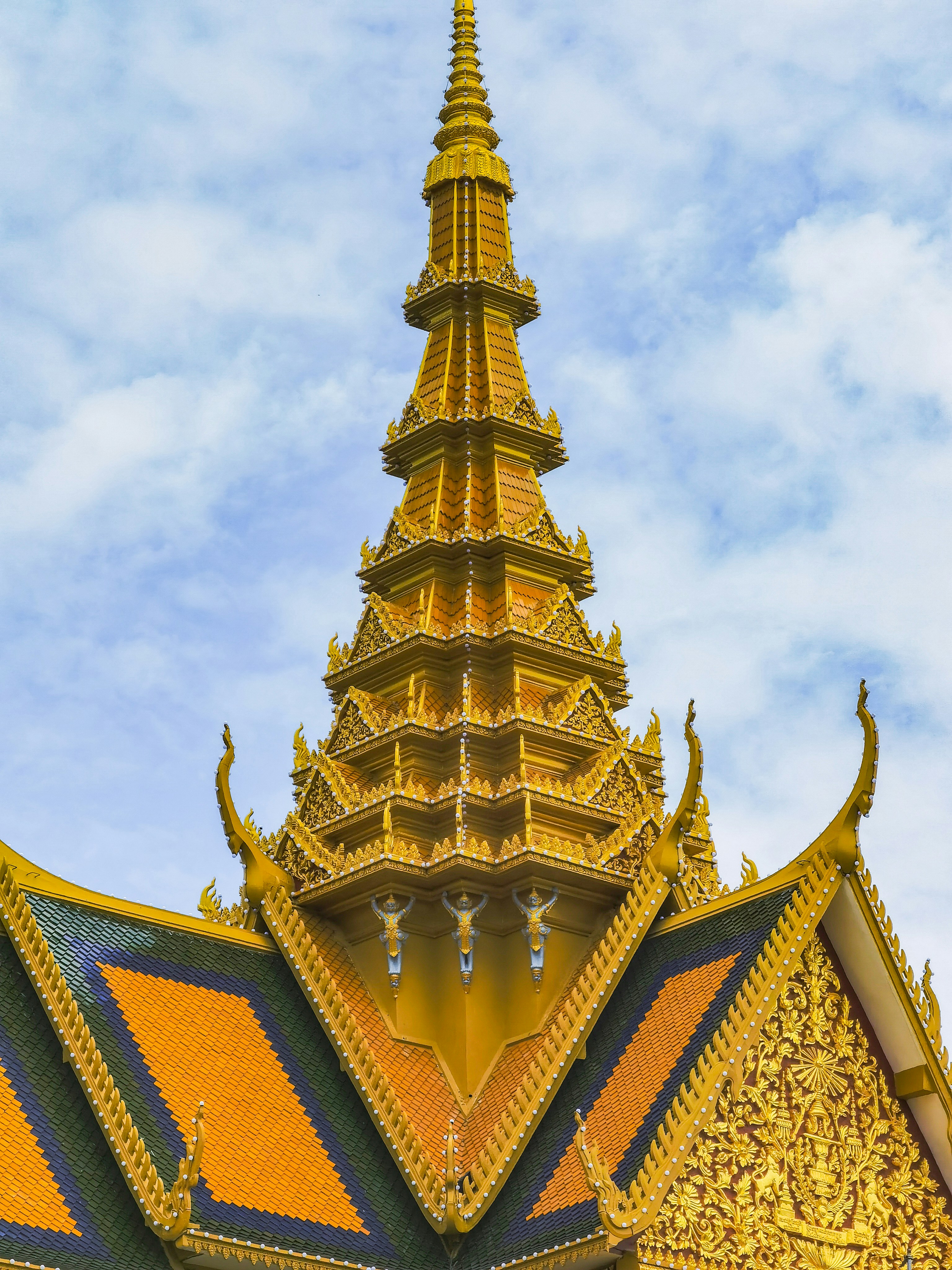 A large golden building with a clock on it's side photo – Free Cambodia ...