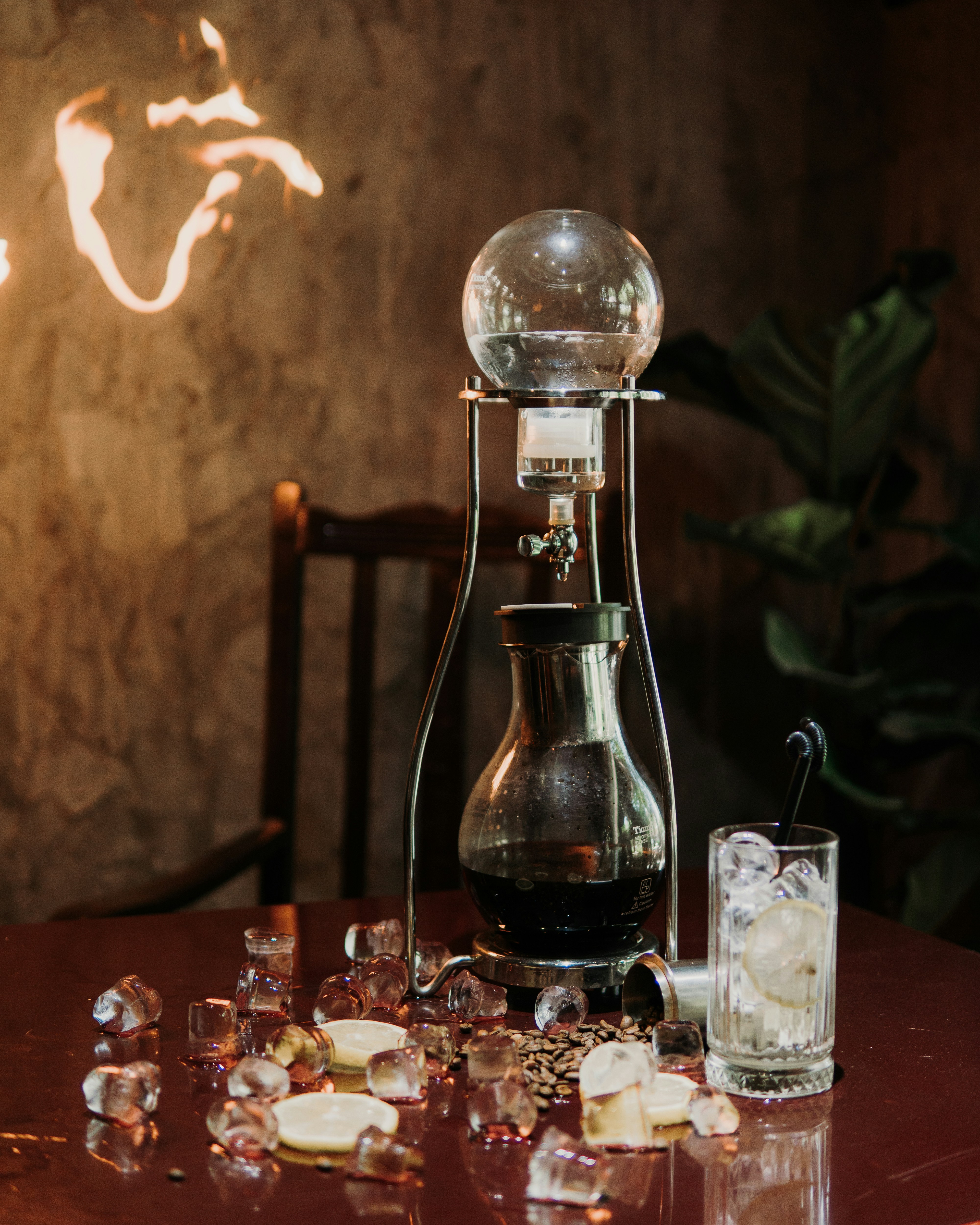 A table topped with a glass filled with liquid photo – Free Apparel ...