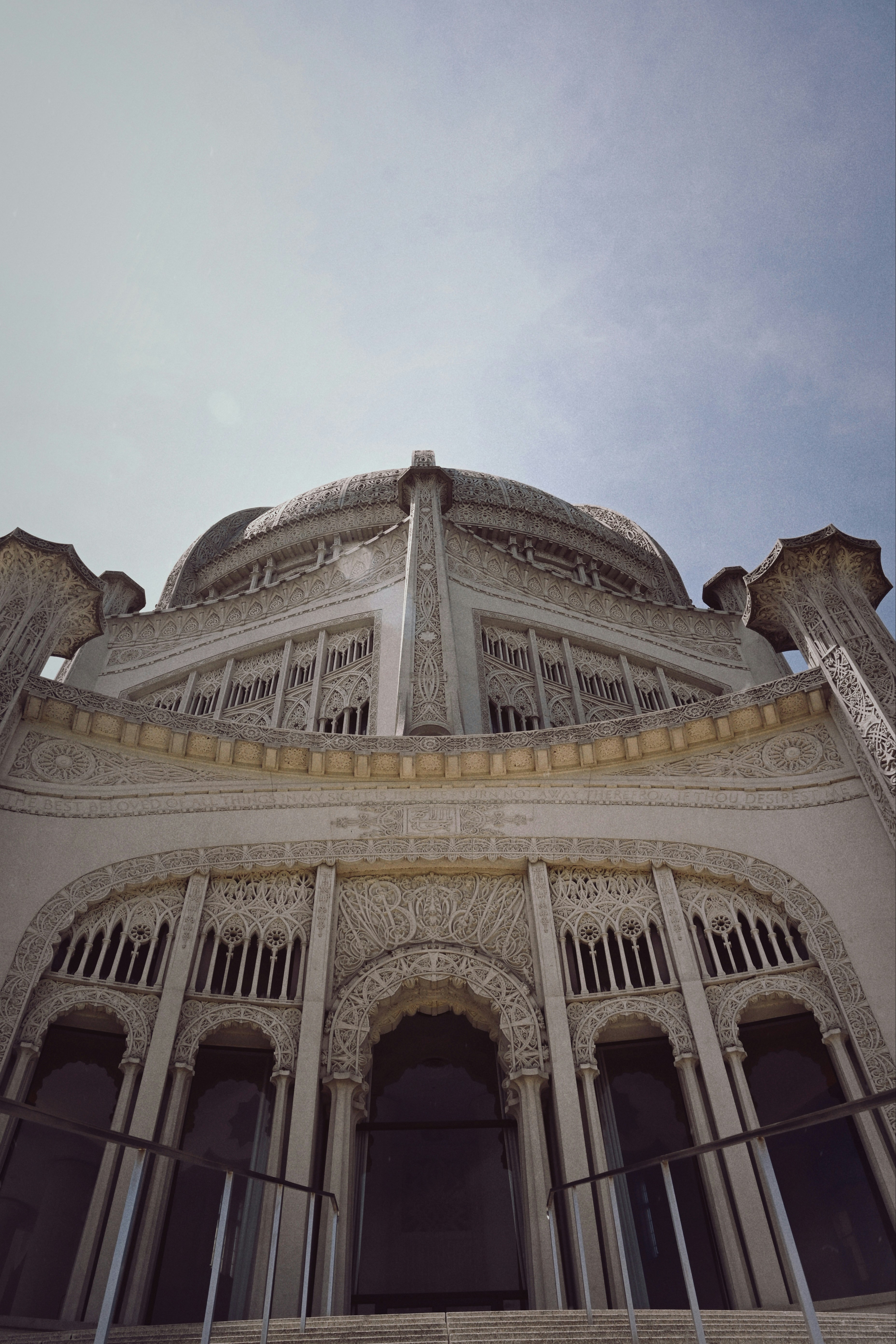 Skyward Lace: Moorish Dome Rising Behind an Arcaded Facade