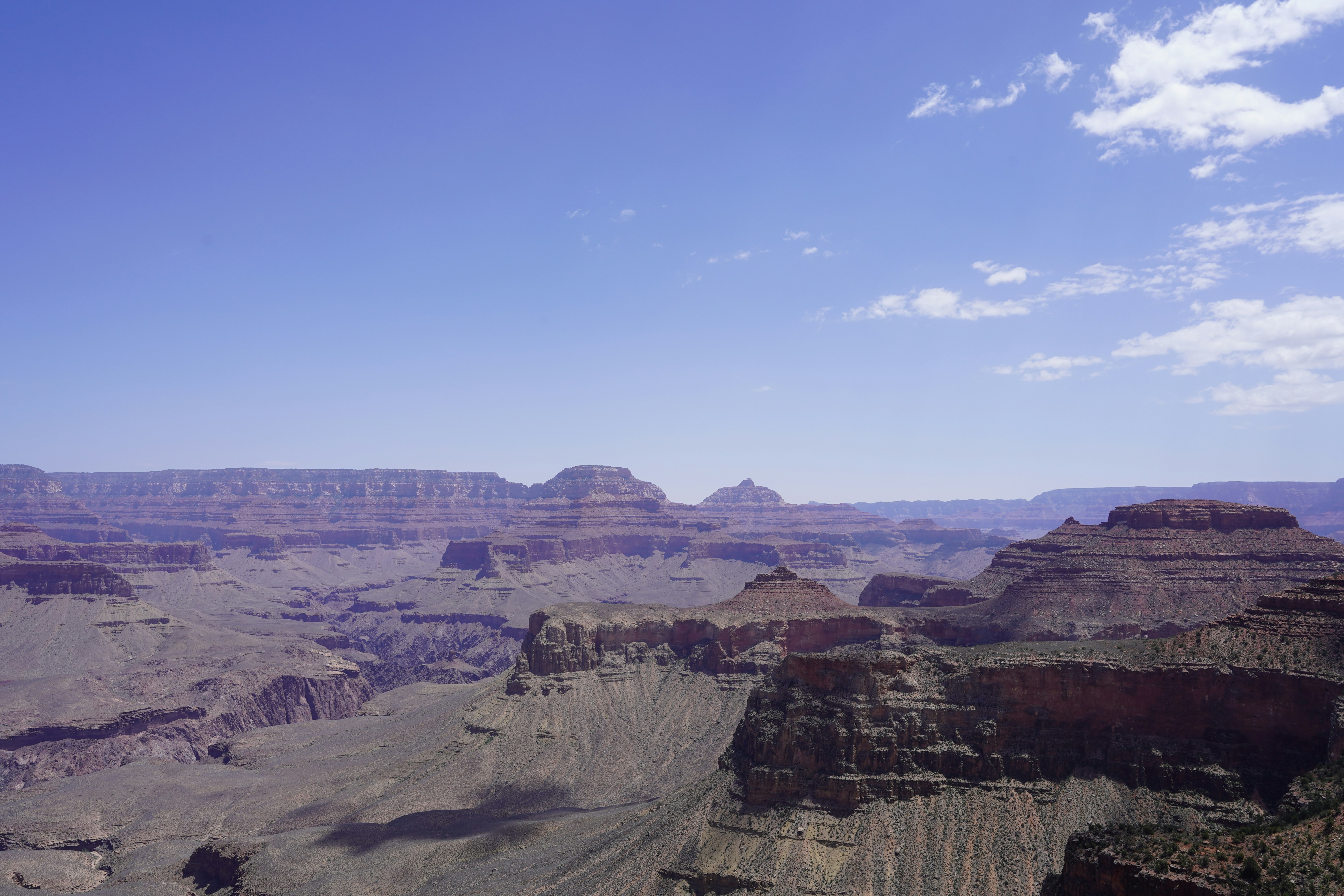 Aegean Echoes: Sunlit Valleys Stretch Across the Grand Canyon–Like Rift