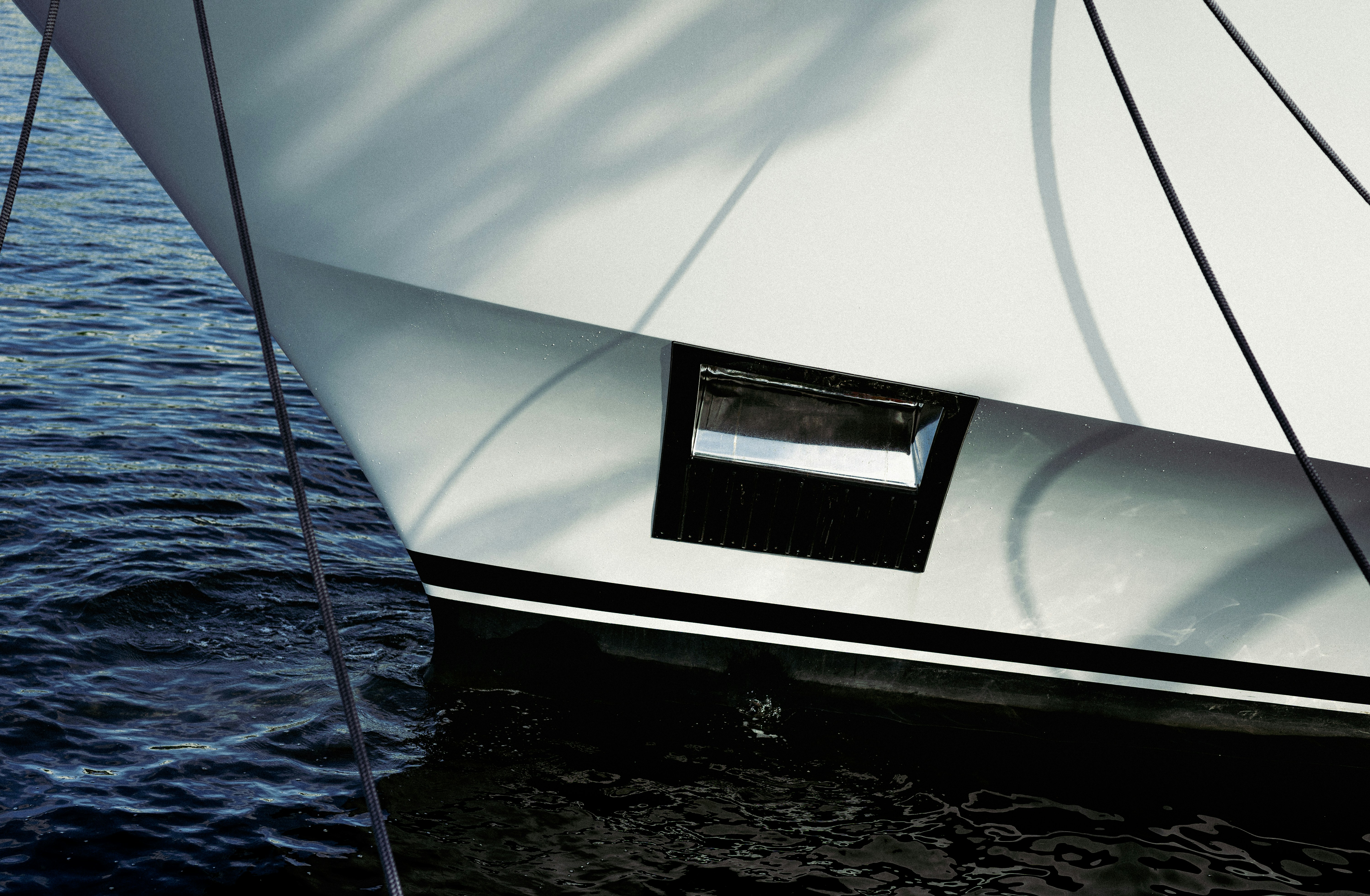 a large white boat is docked in the water