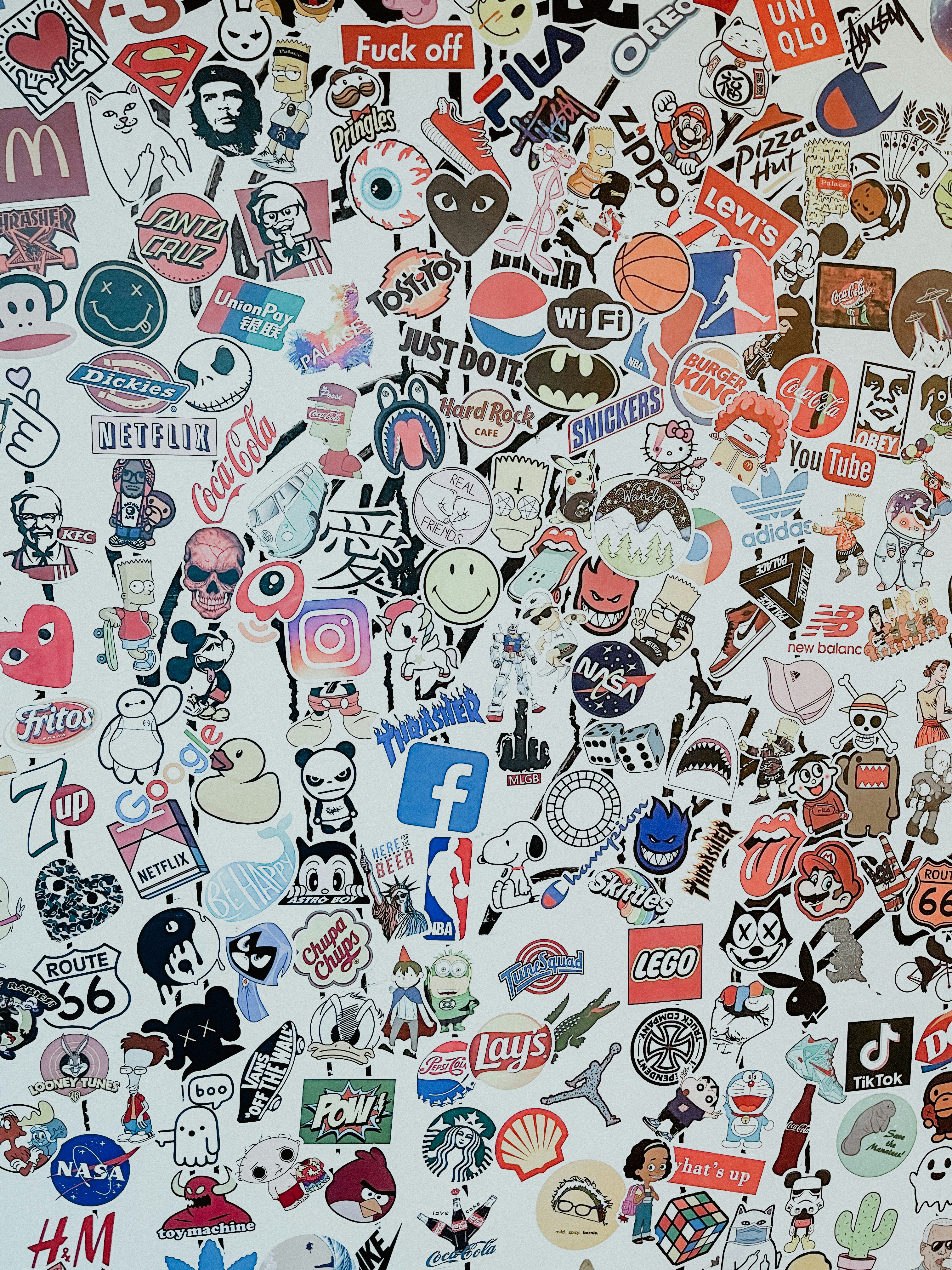 A bunch of stickers on a white surface photo – Free Grey Image on Unsplash