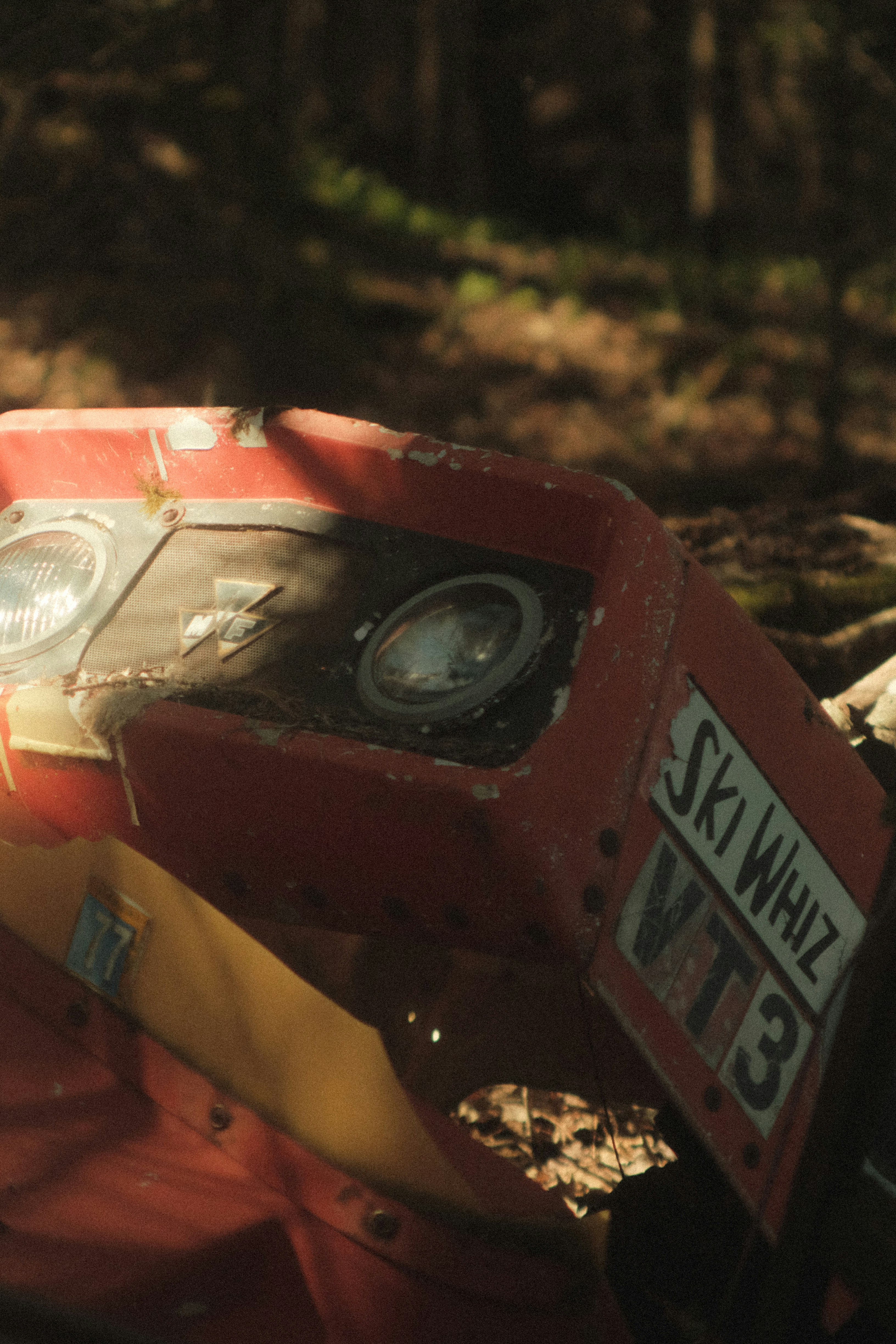 Red Distant Memory: A Tilted Snowmobile in Dusk