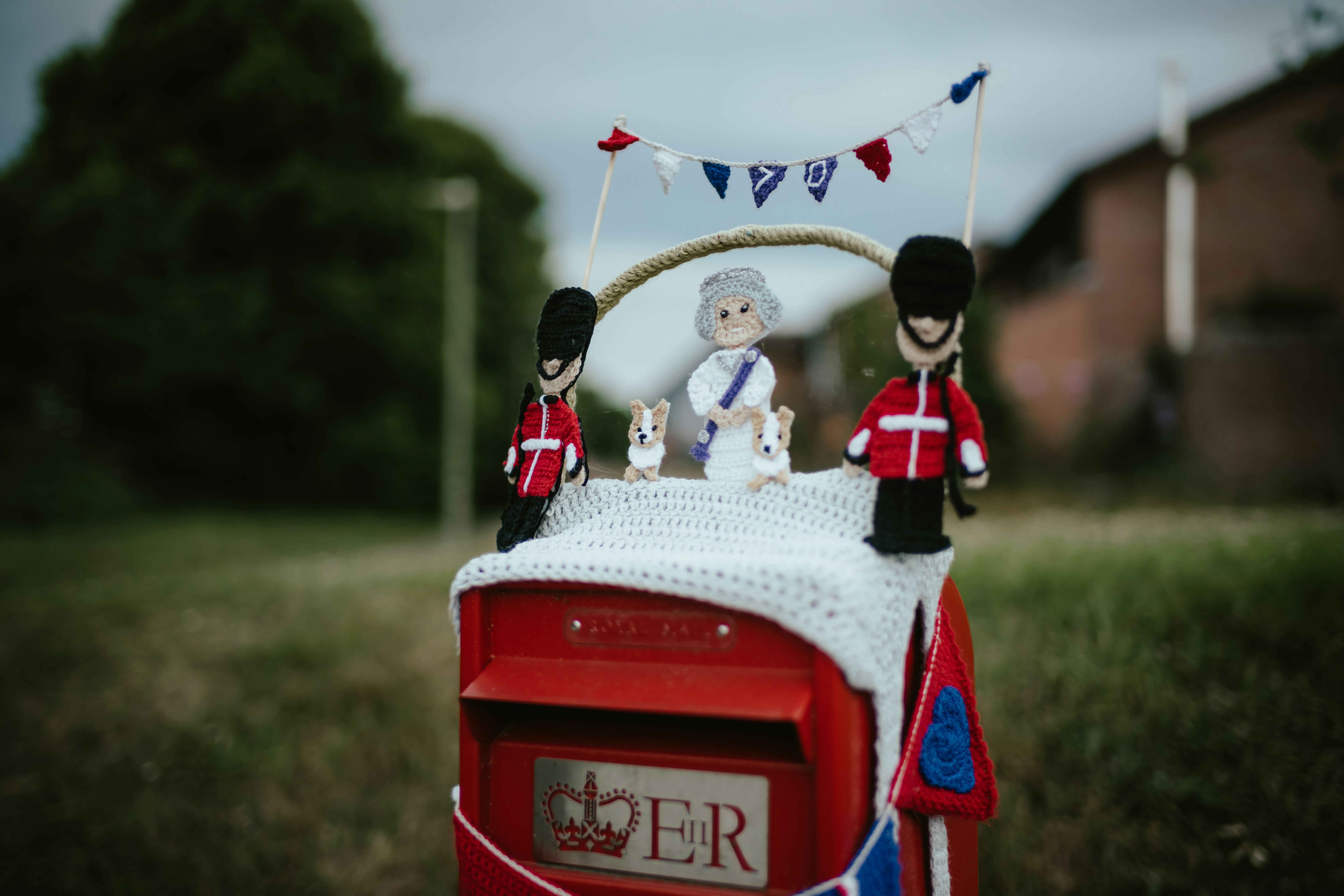 Festive Mailbox Parade: Handcrafted Figures On a Red Post