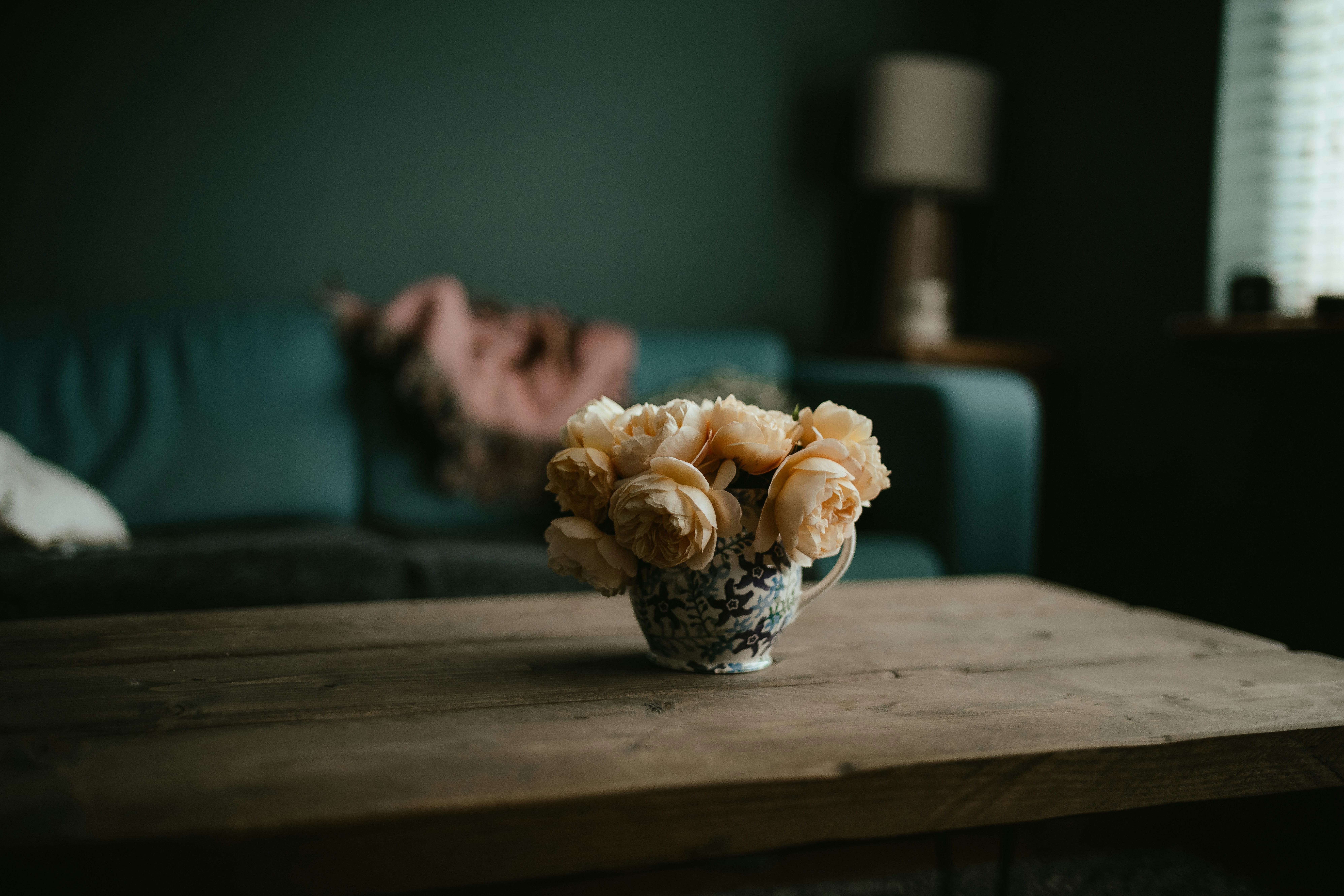 Porcelain Roses on a Weathered Table: Quiet Indoor Light