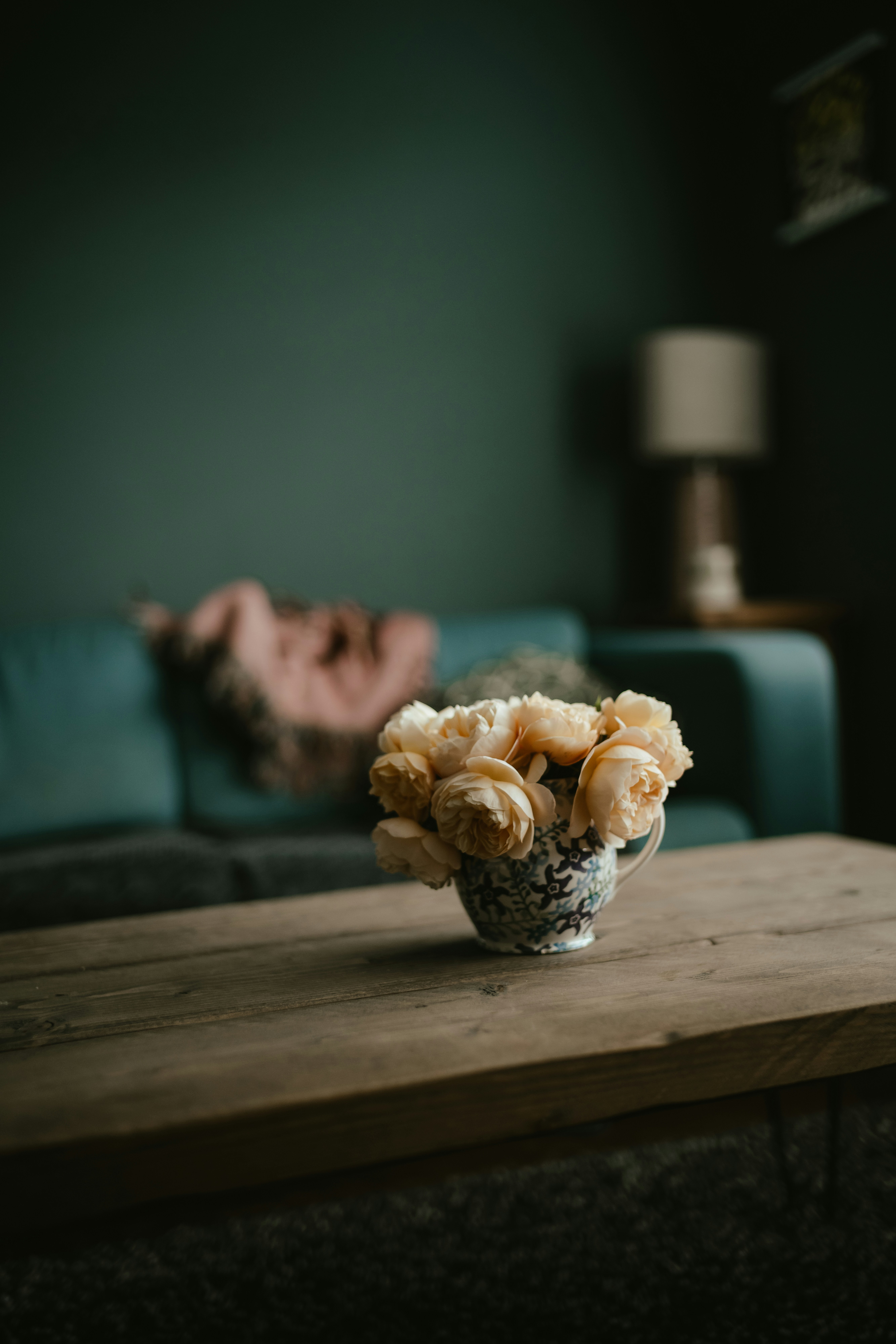 Creamy Roses on a Weathered Table in a Quiet living Room