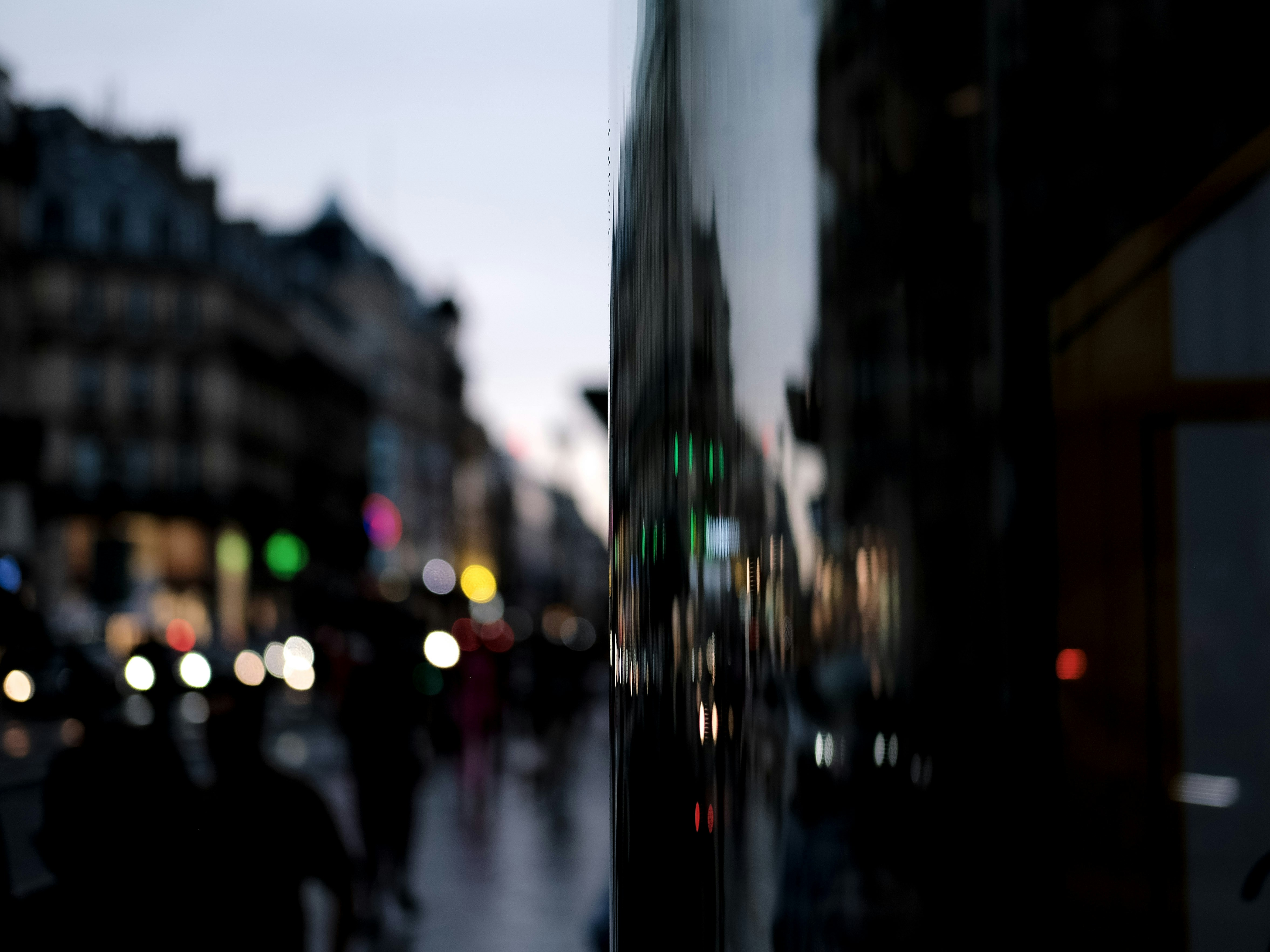 A blurry photo of a city street at night photo – Free Paris Image on ...