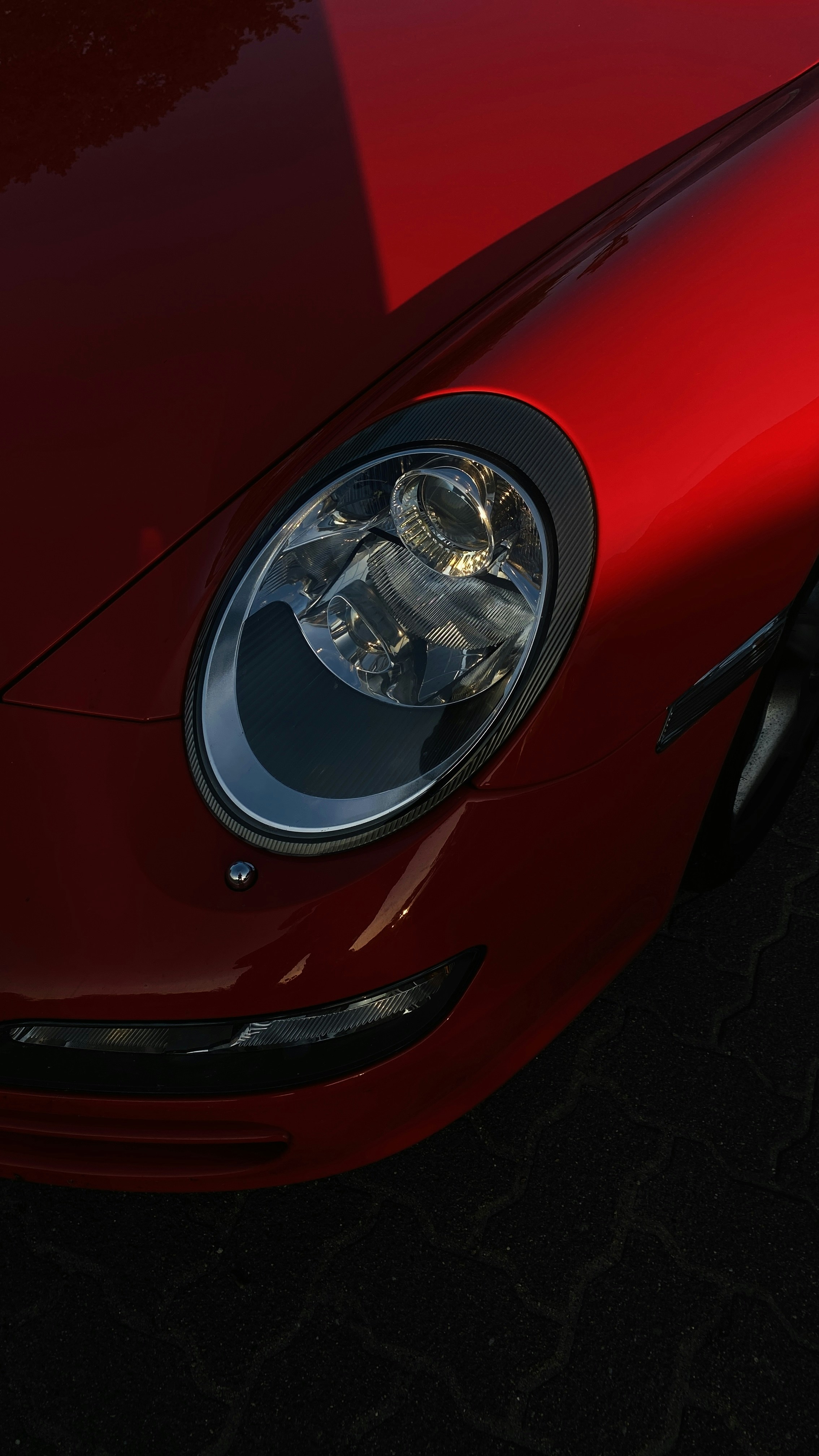 A close up of a red sports car headlight photo – Free Germany Image on ...