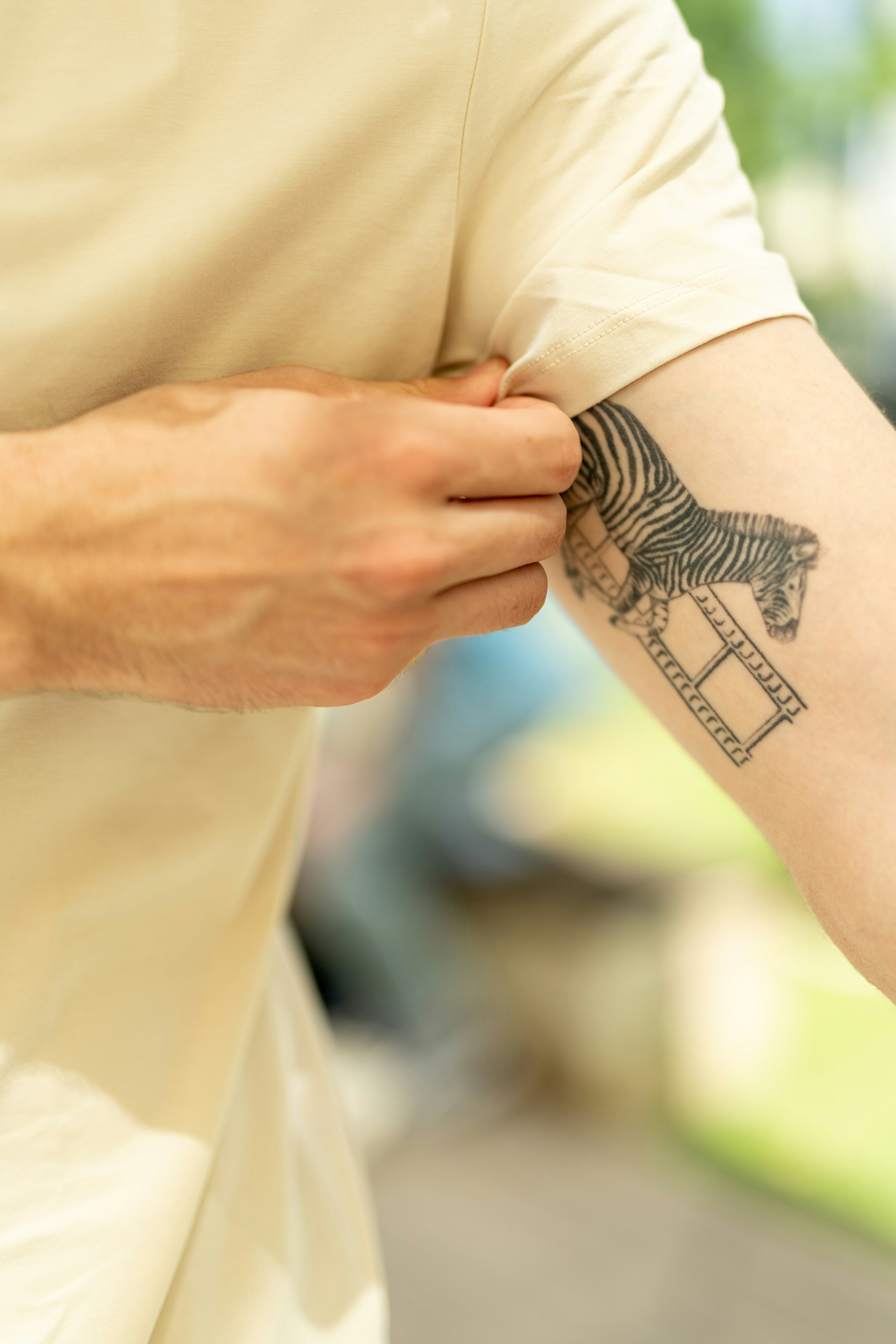 A man with a zebra tattoo on his arm photo – Free Skin Image on Unsplash