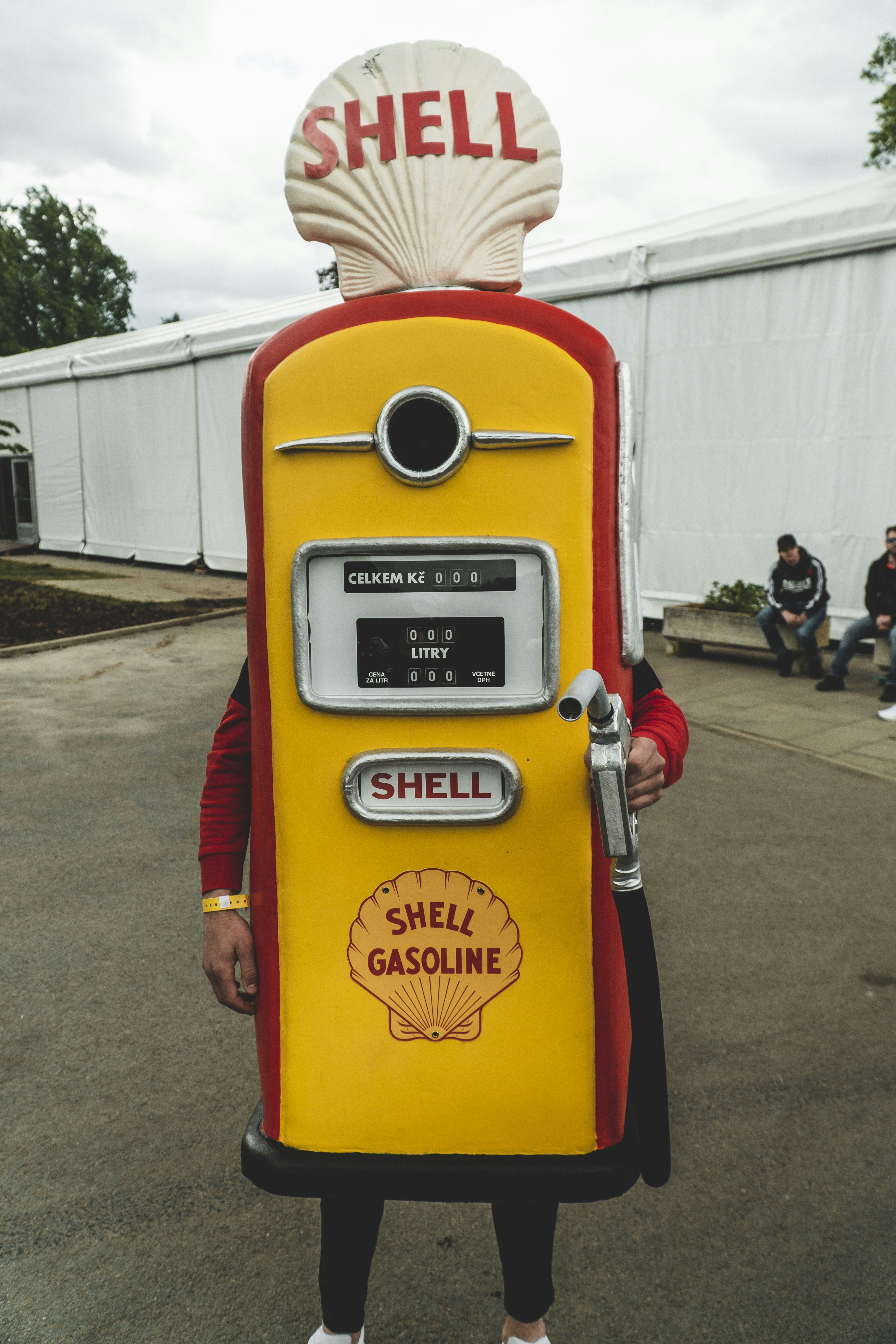A person in a costume made to look like a shell gas pump photo – Free ...