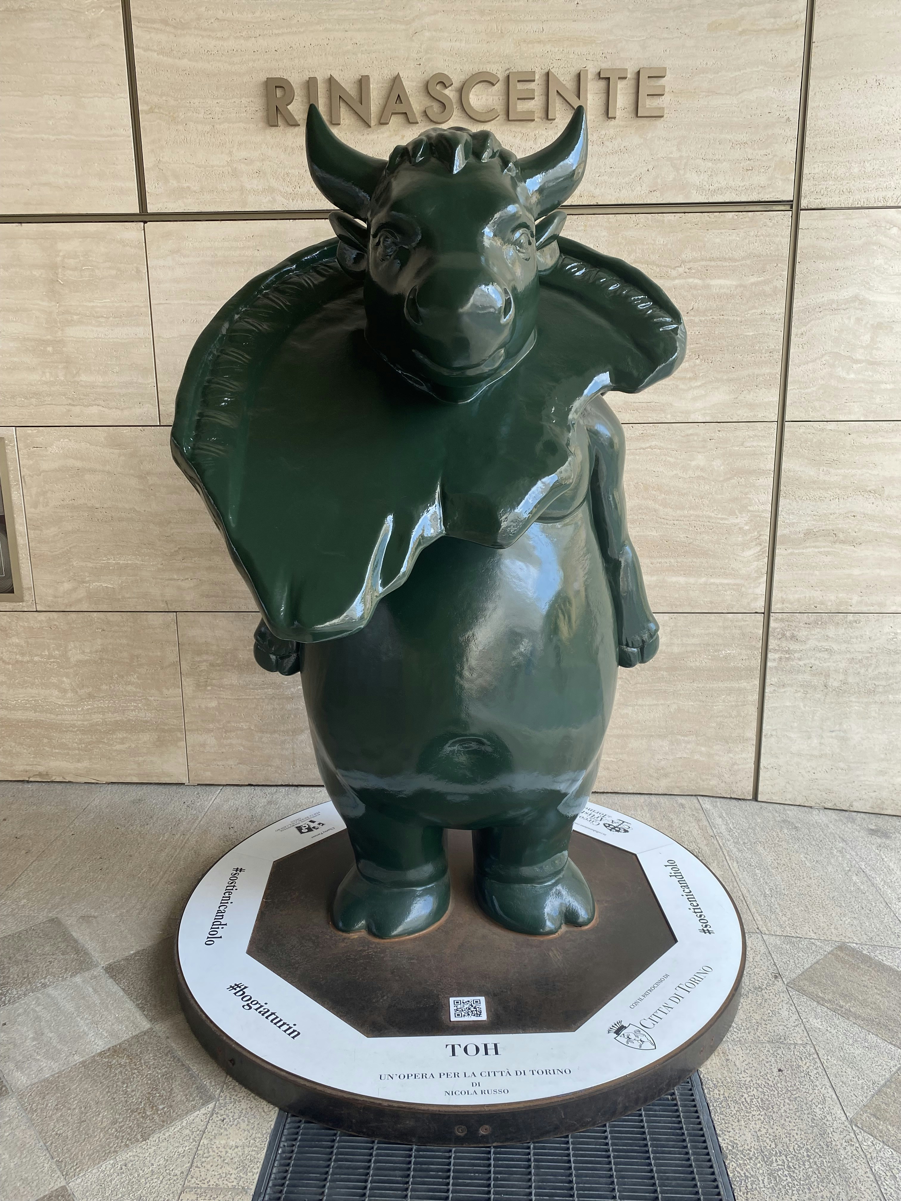 Emerald Hellion at Rinascente: A glossy horned guardian