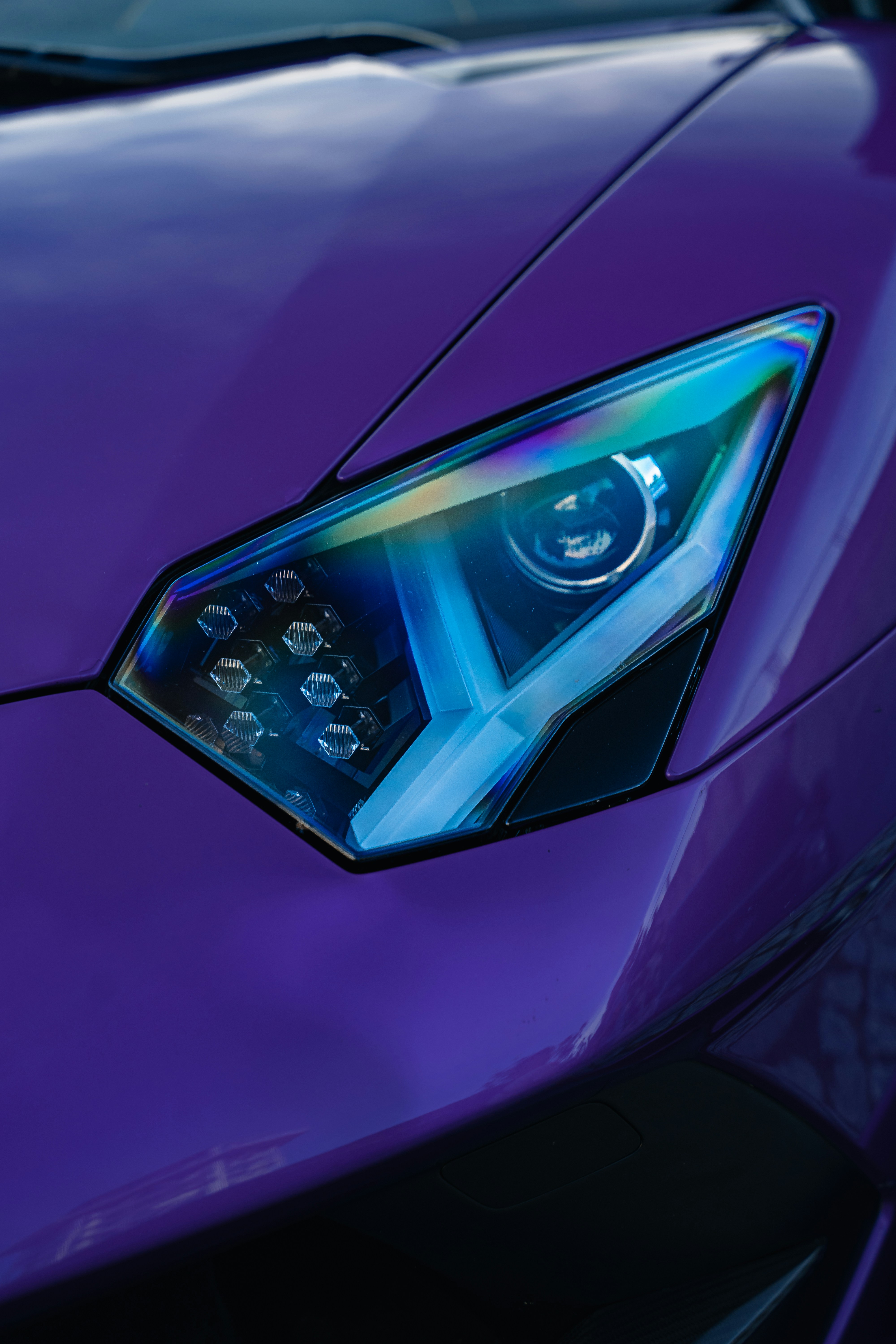 Violet Precision: Neon-Accented Headlight Close-Up