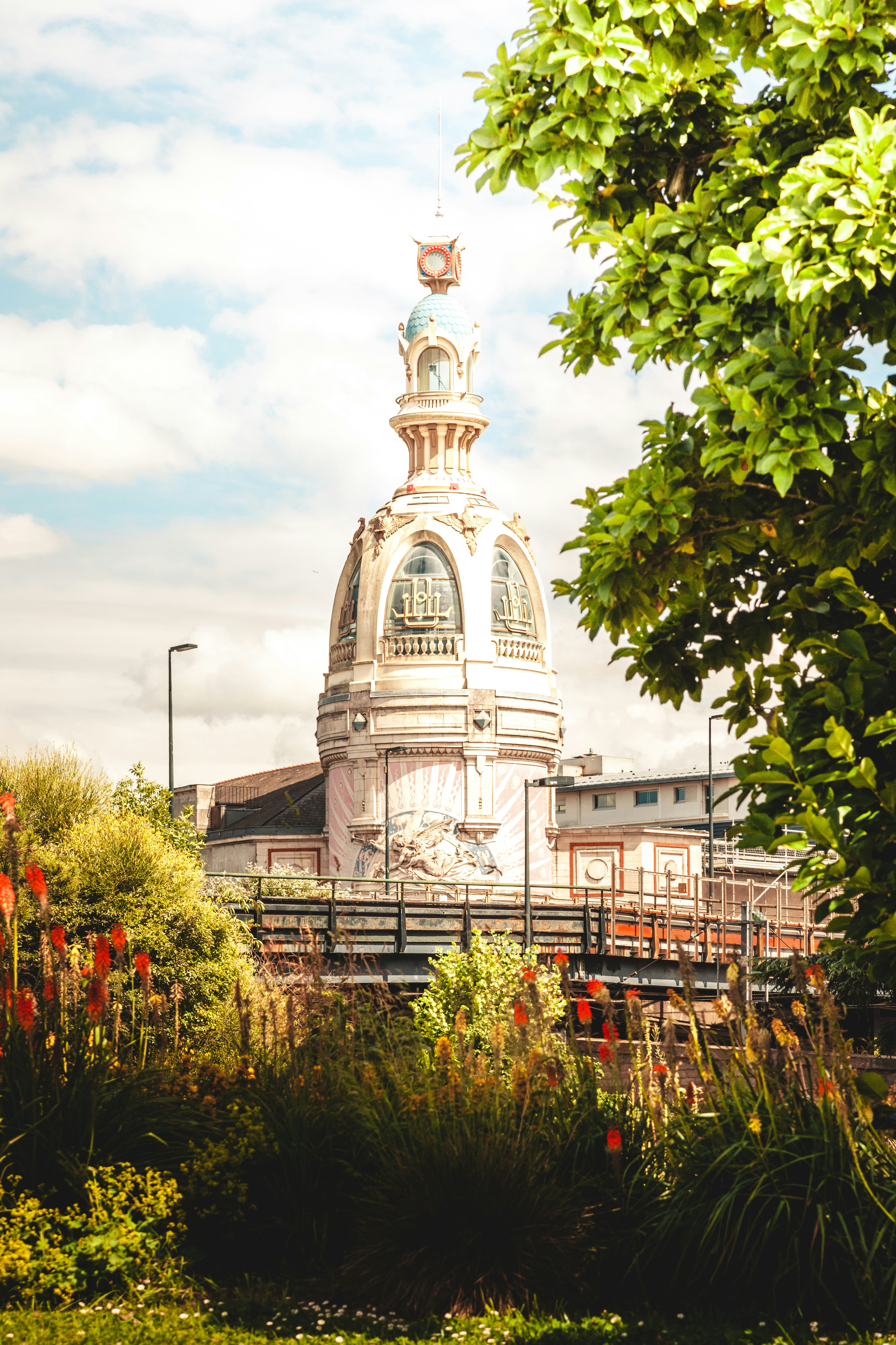 A small clock tower in a garden photo – Free France Image on Unsplash