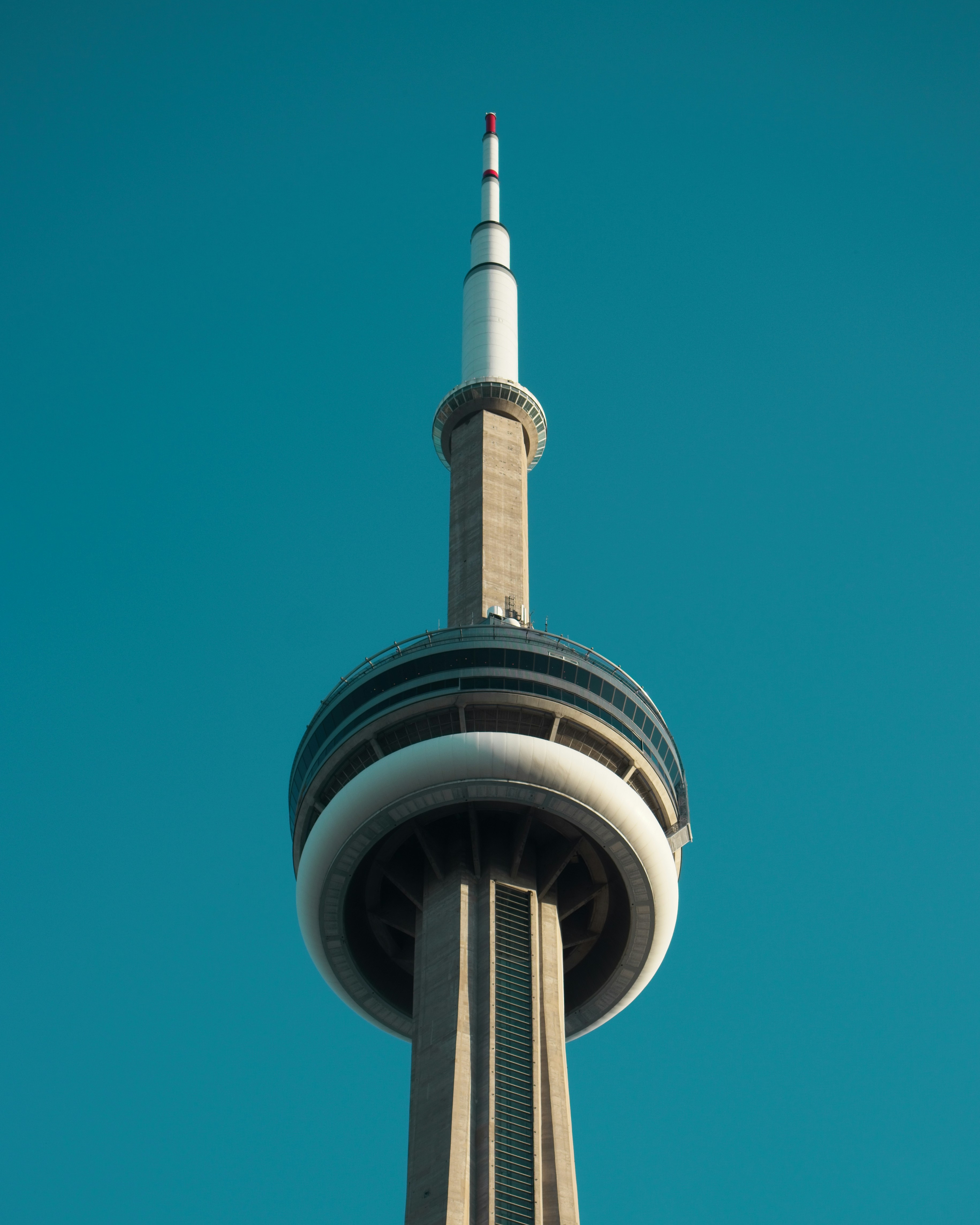 A very tall tower with a clock on it's side photo – Free Contrast Image ...