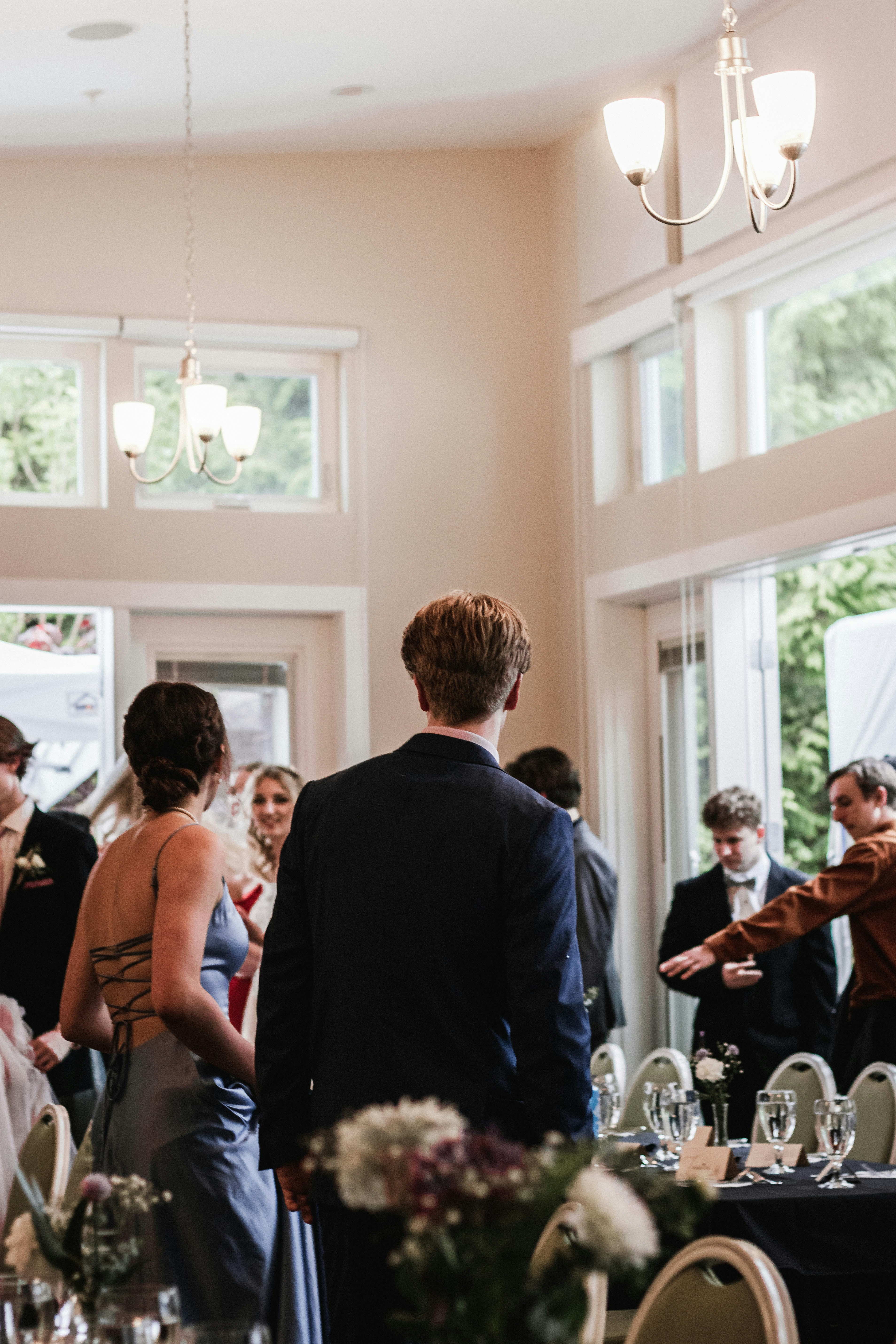 a group of people standing around a table