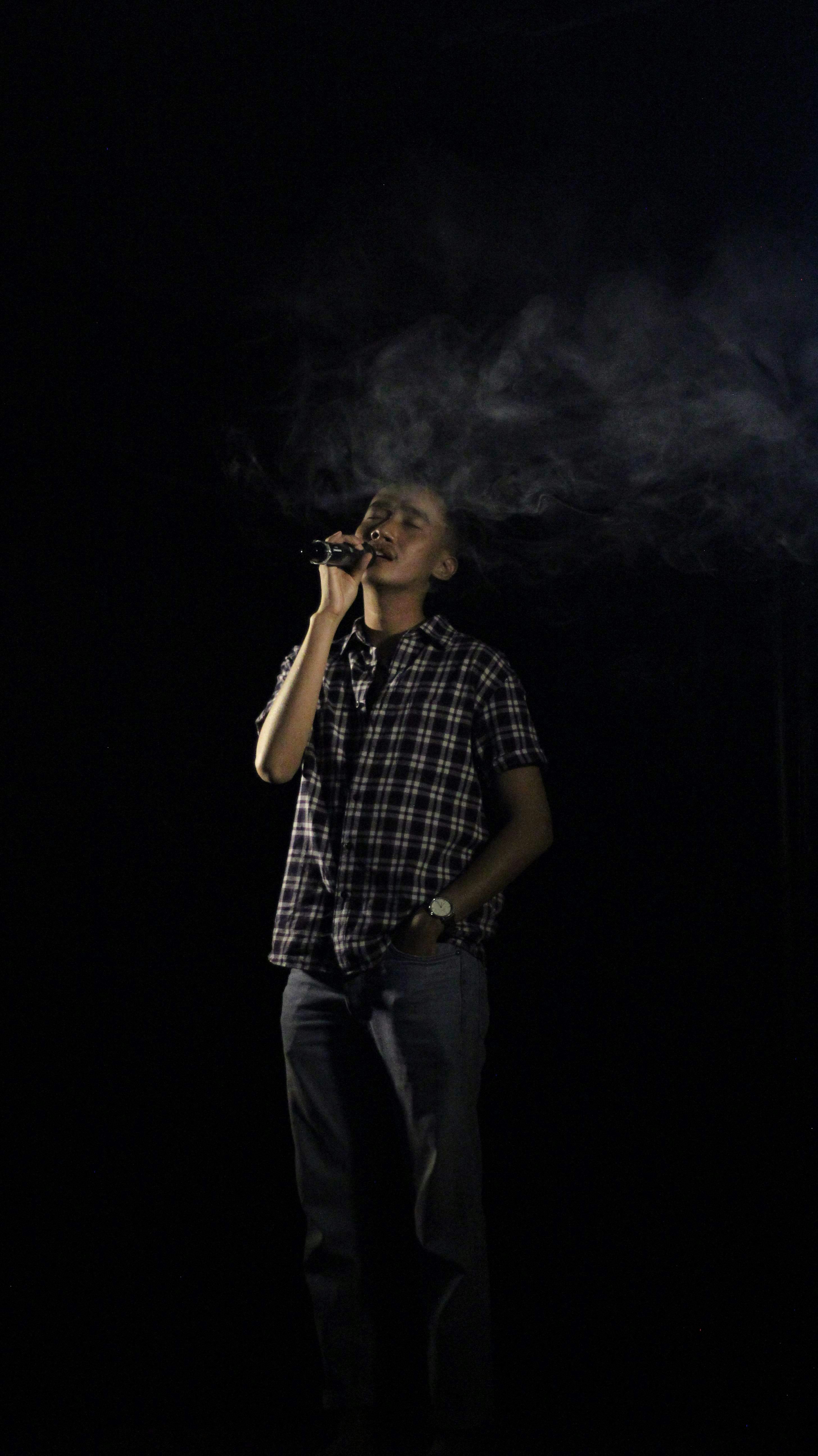 Midnight Mic: Smoke-Framed Solo Singer on a Shadowed Stage
