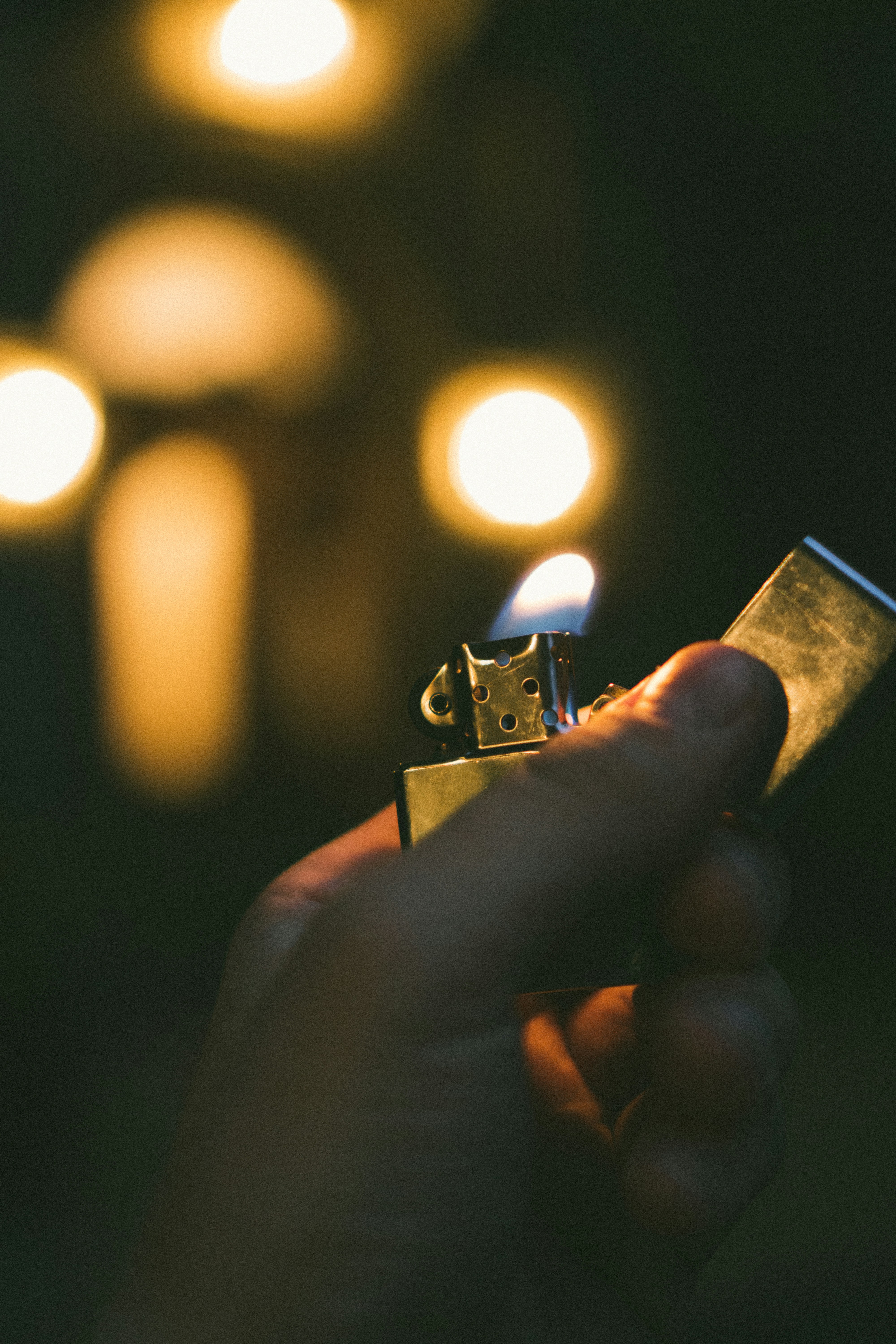 A person holding a lighter in their hand photo – Free Lighter Image on ...