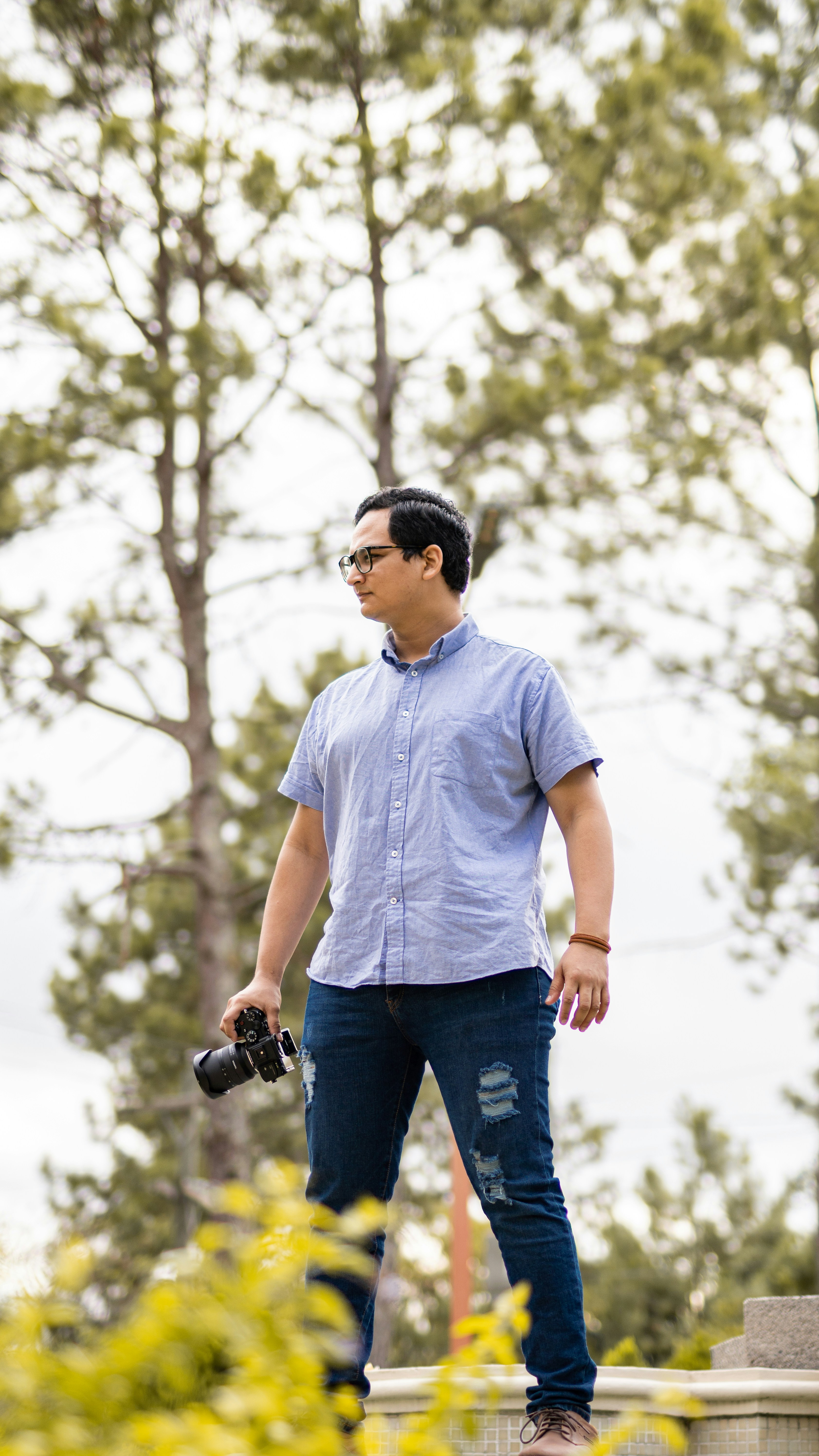 Portrait in the Park: A Focused Moment with a Photographer in Blue