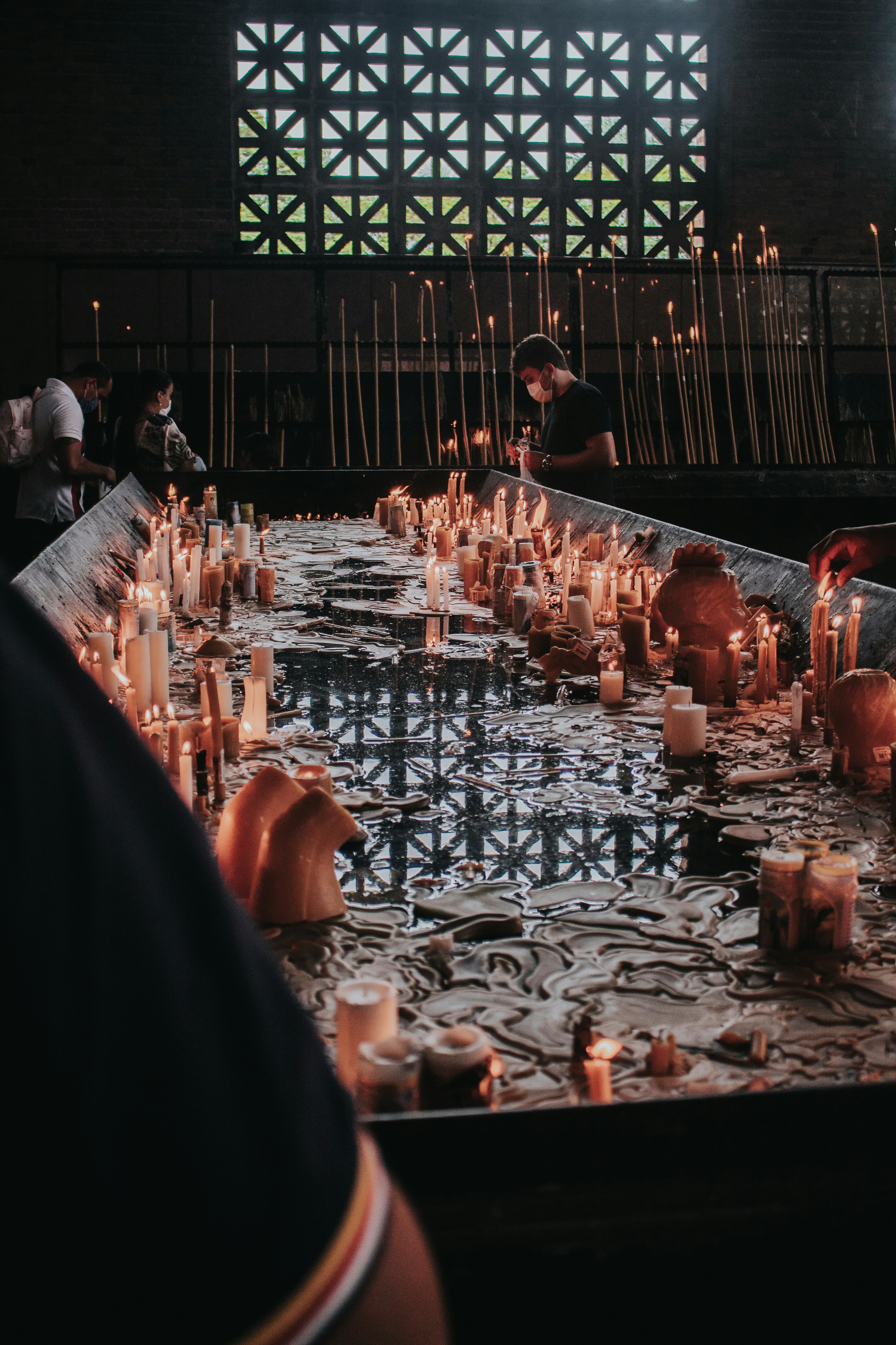 Candlelit Vigil Along a Sacred Sulpture of Fire