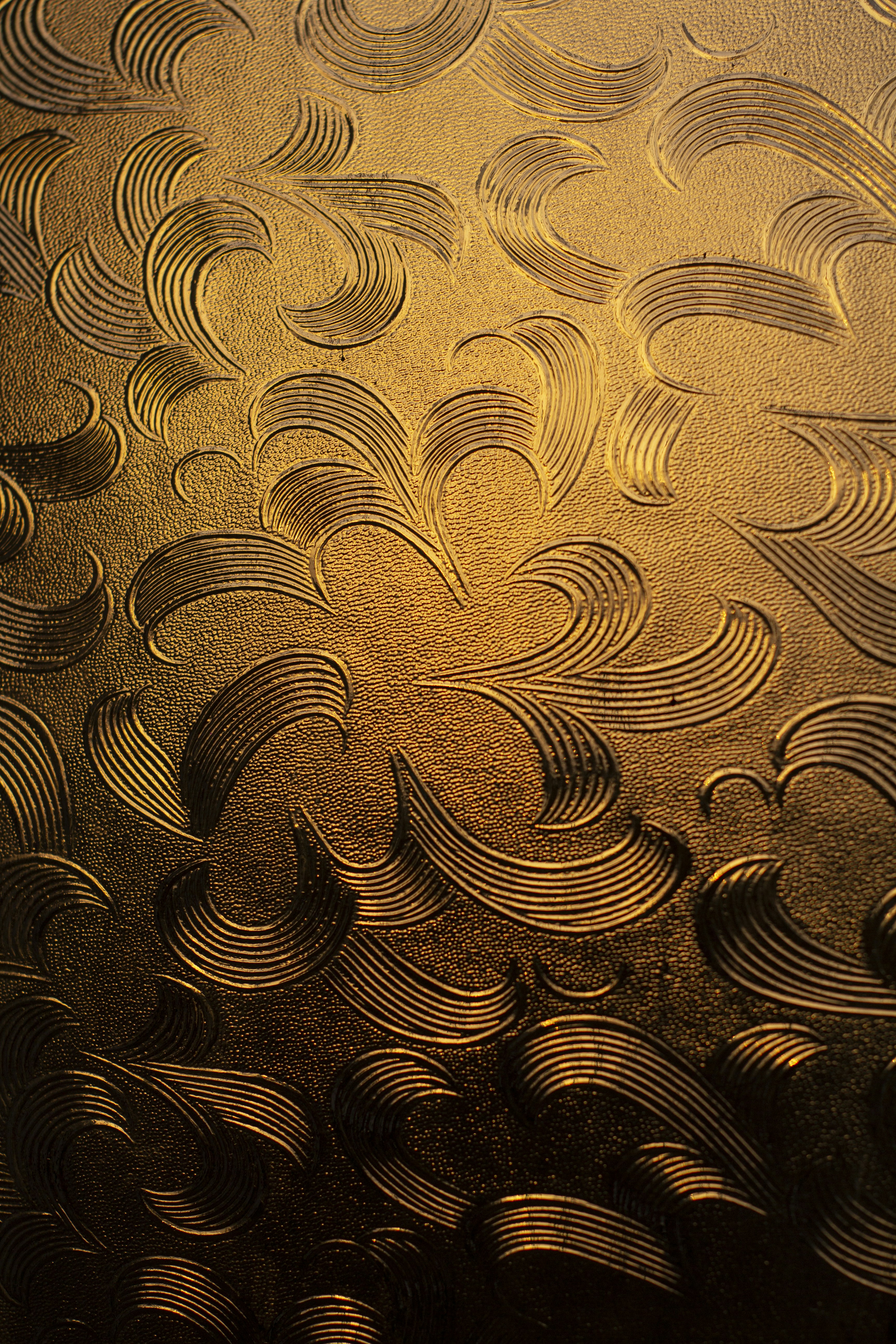 Golden Crescents: Macro Portrait of an Embossed Texture