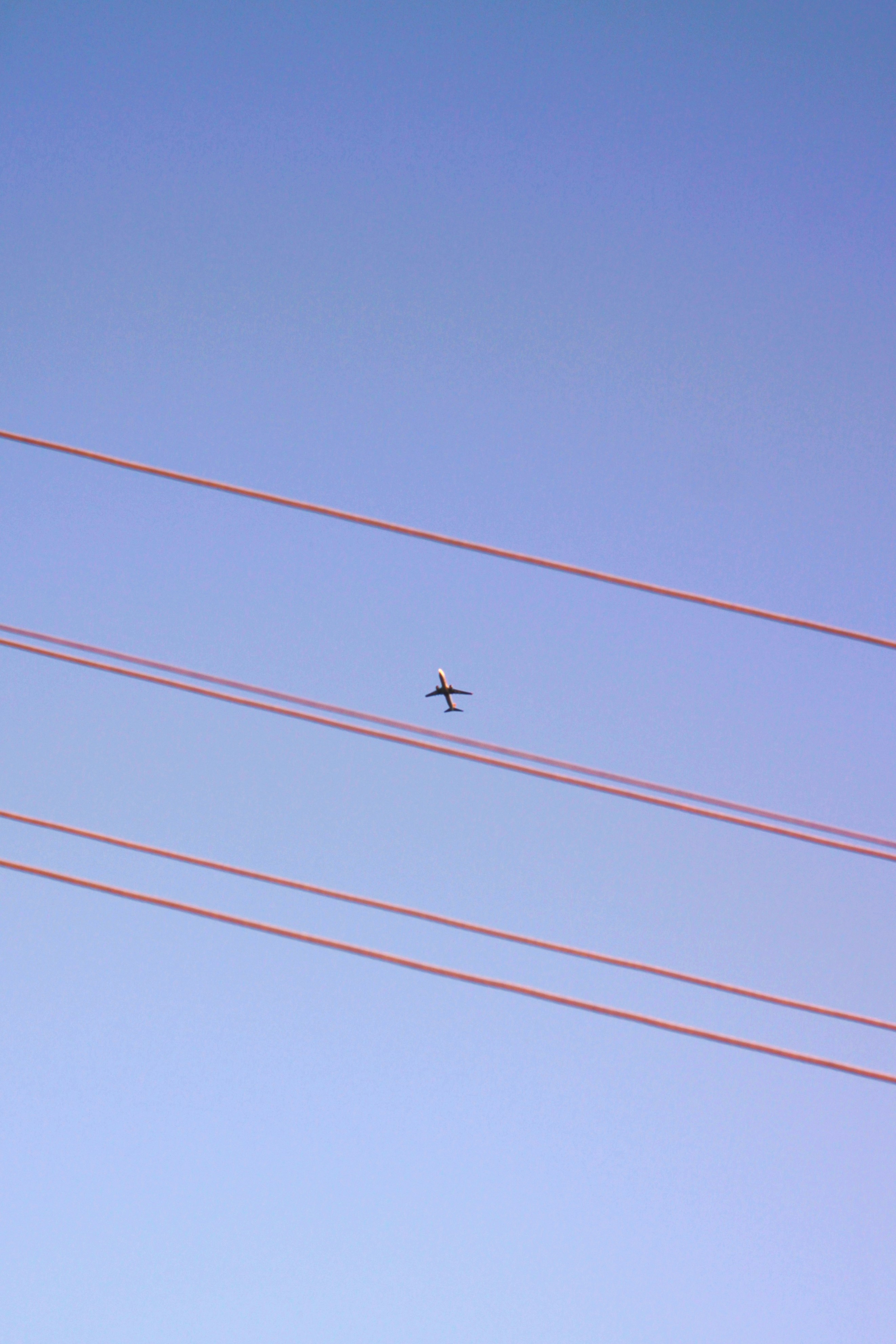an airplane is flying high in the sky