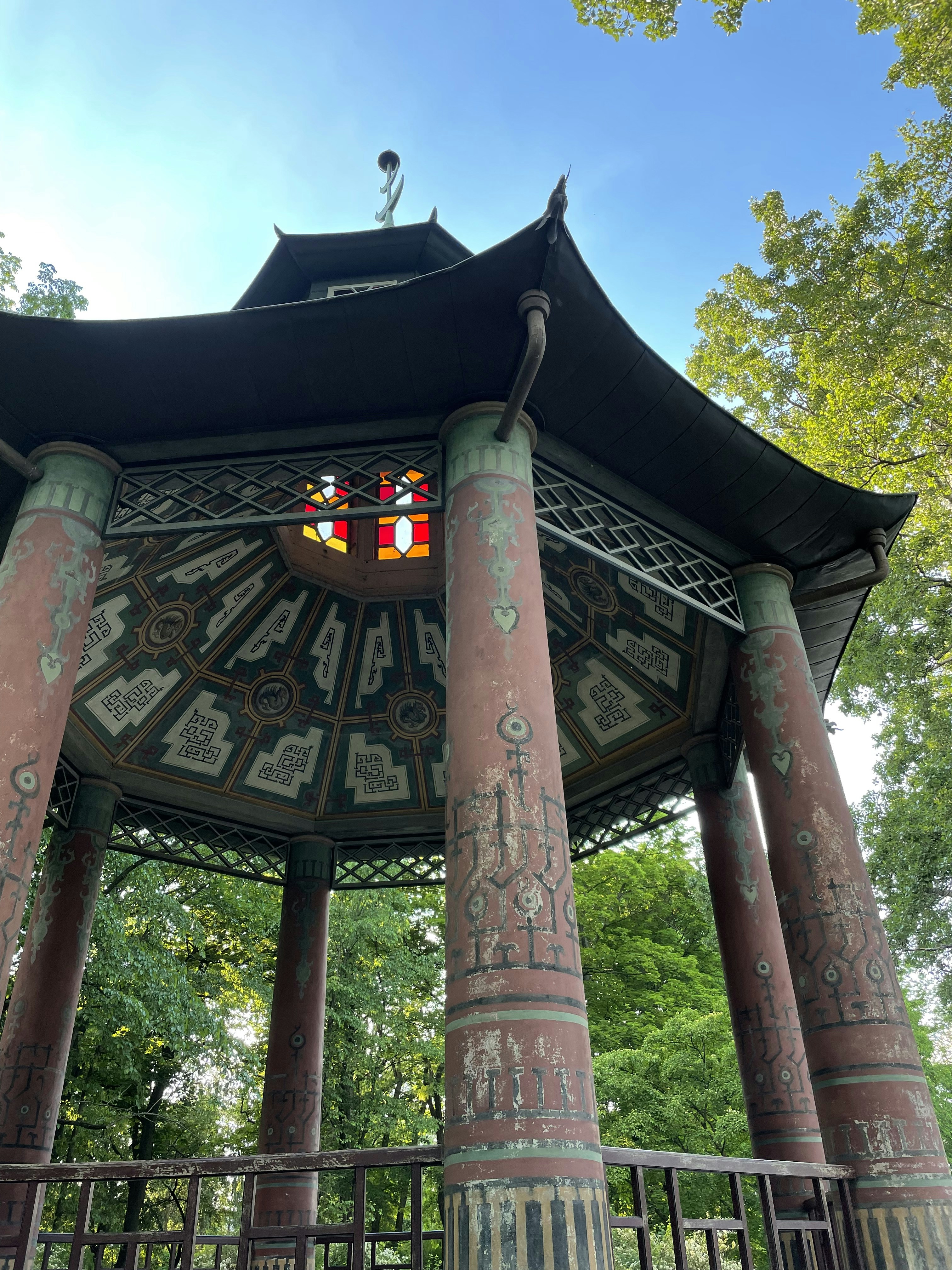 a clock tower in the middle of a park