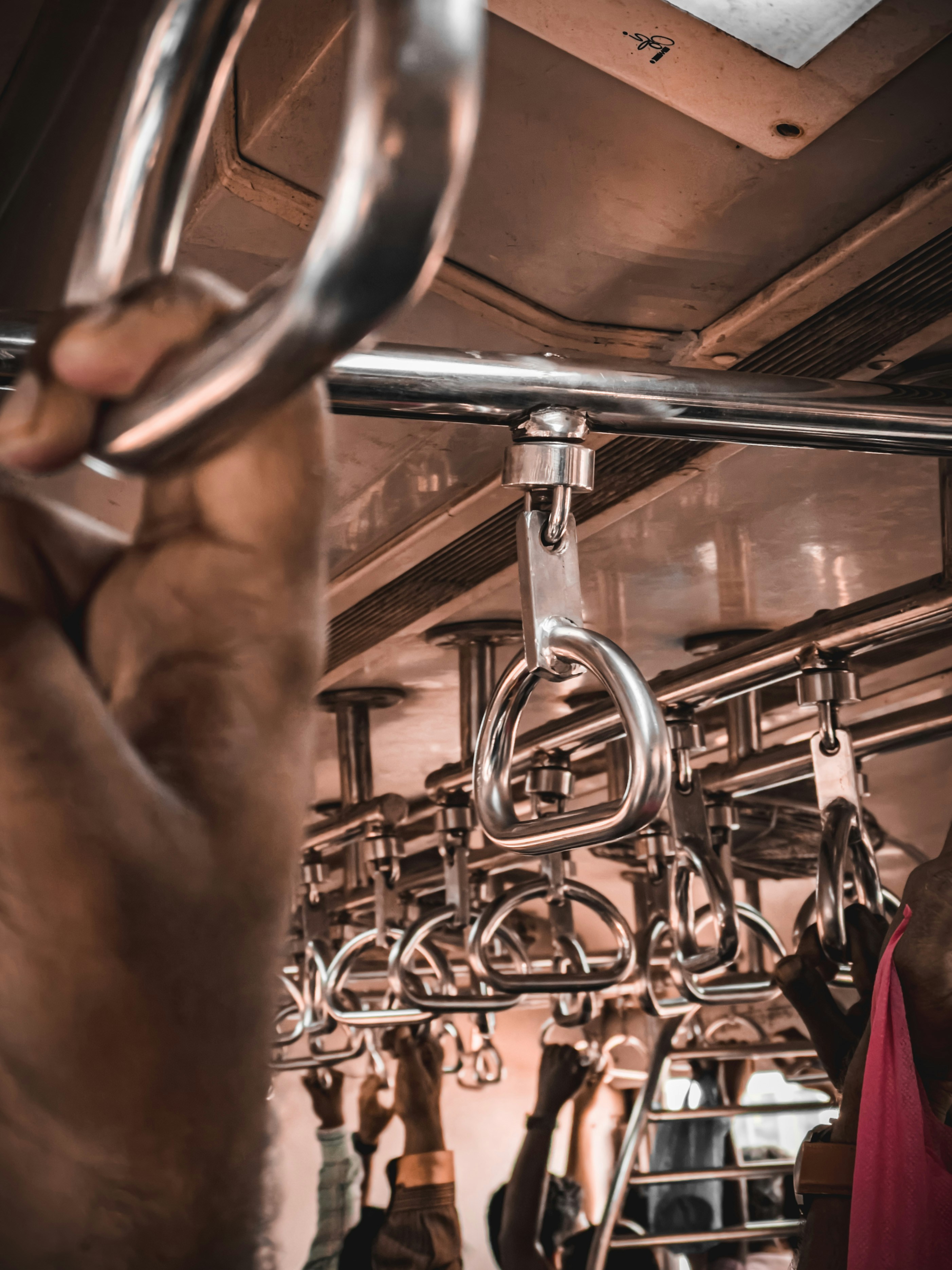 Handrails and Hangers: A Closer Look at a Packed Train Interior