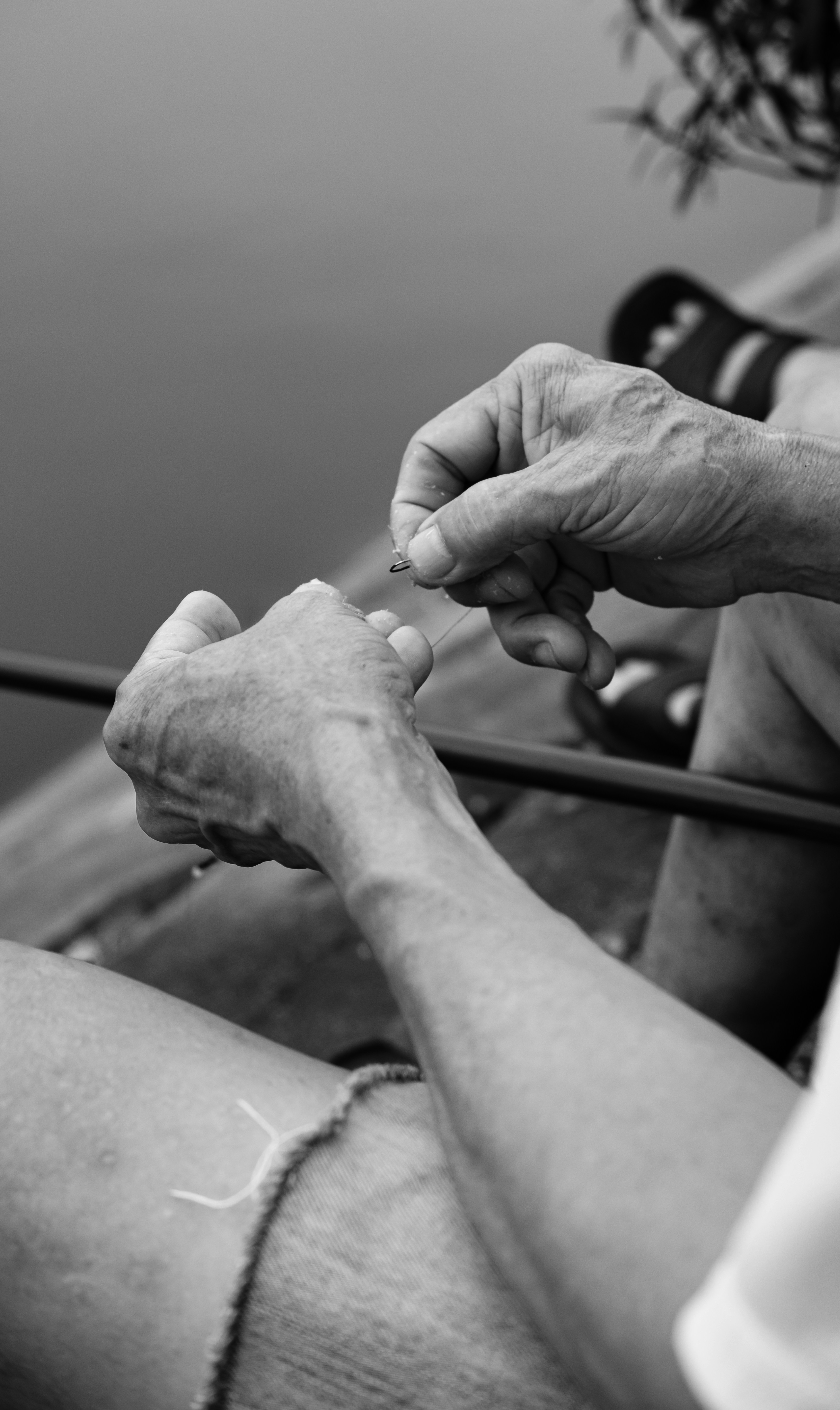 Hands Crafting a Tiny Moment: A Zoom on Grip and Thread