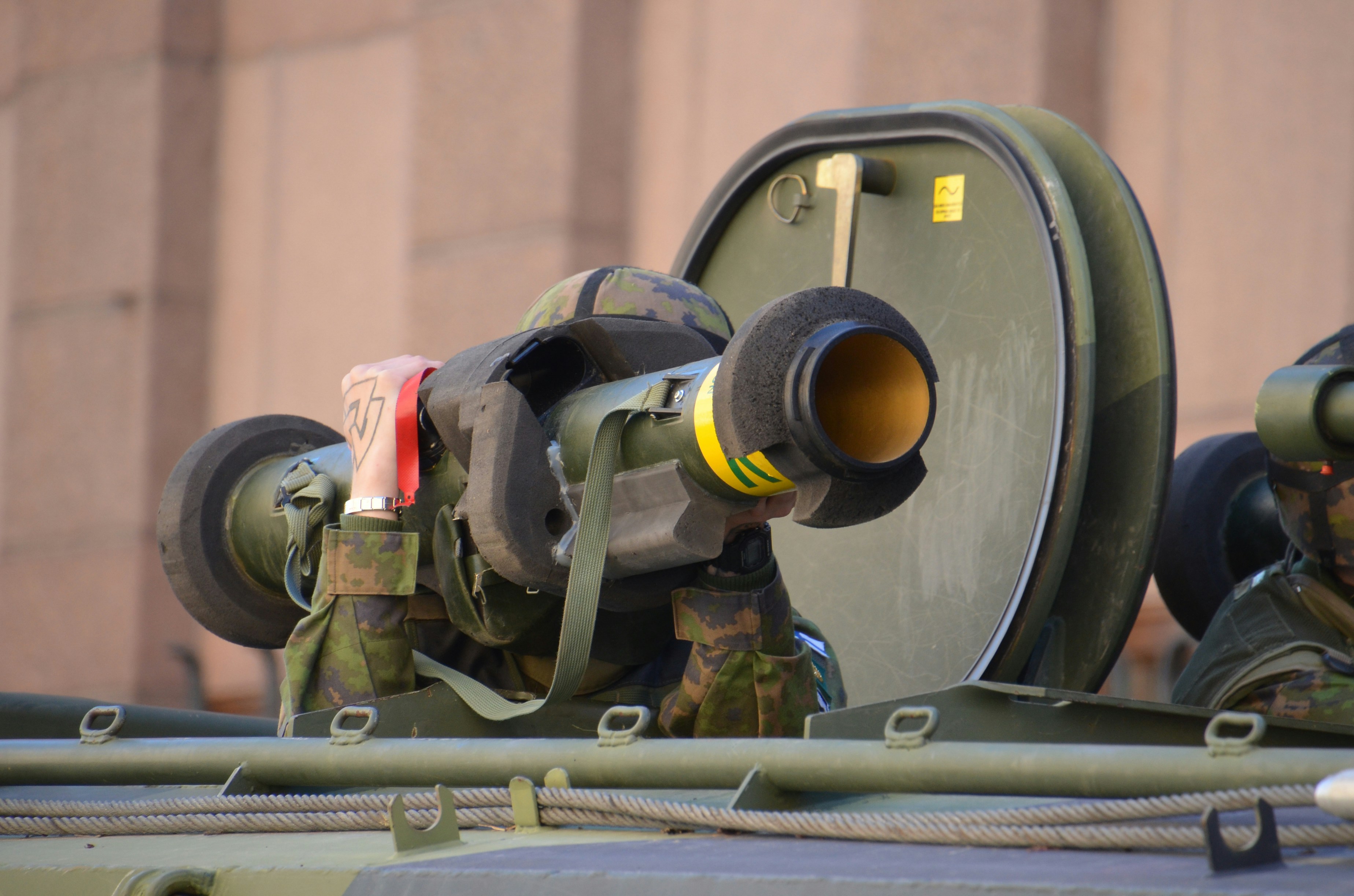 A close up of a machine gun on top of a tank photo – Free Helsinki ...