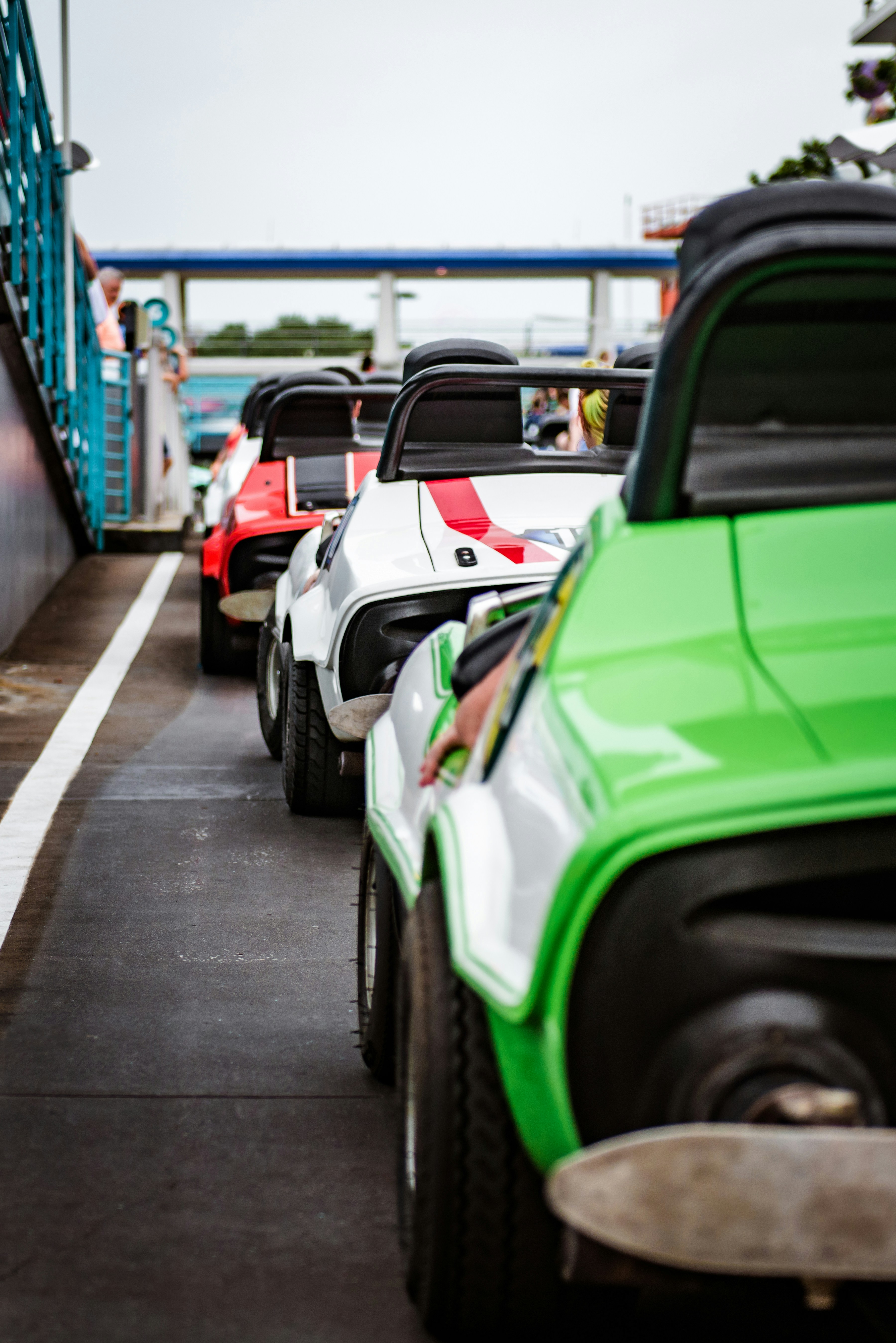 Emerald Lead in a Line of Colorful Bumper Cars