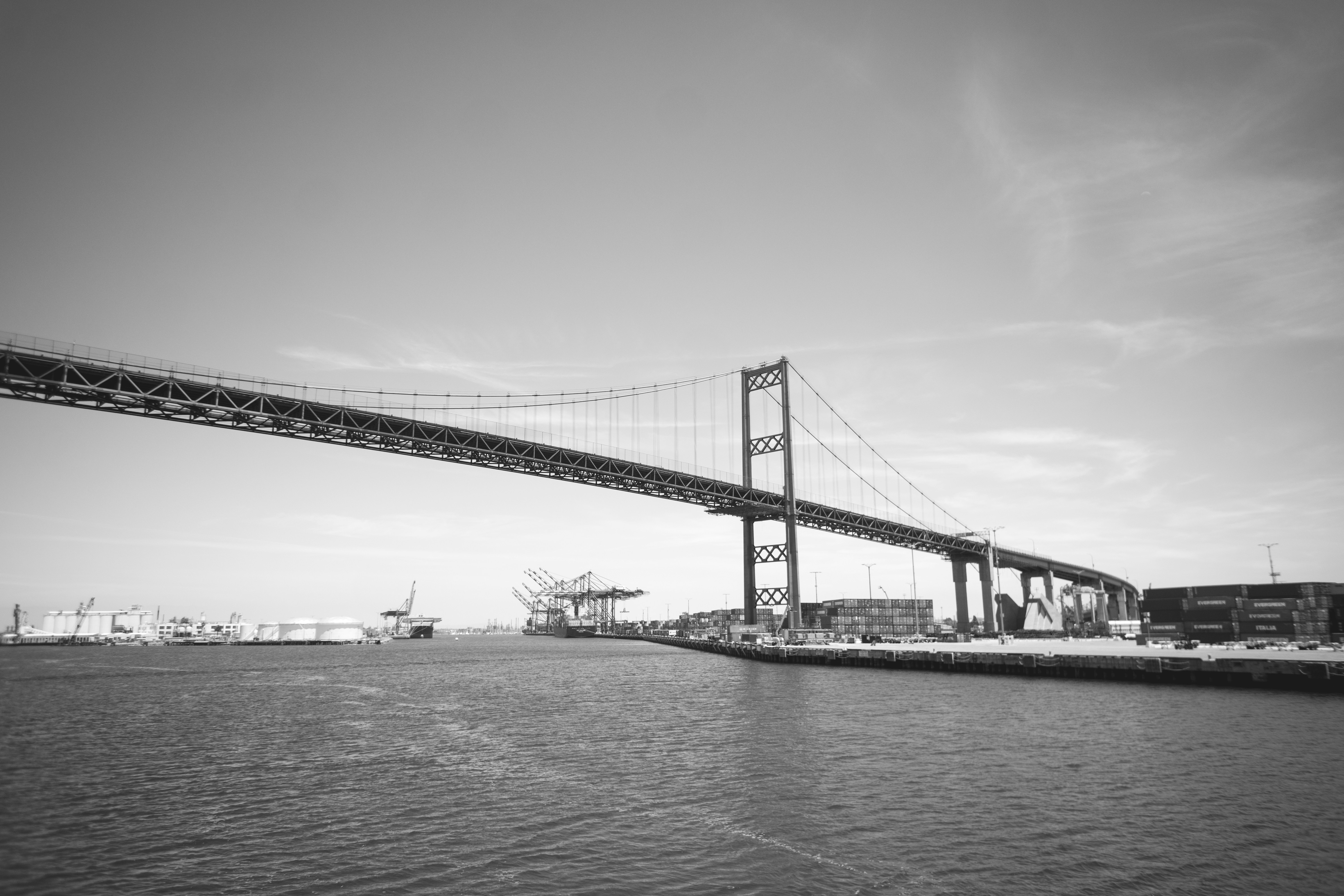 Monochrome Span Over the Harbor: A Bridge Quietly Binds Water and Sky
