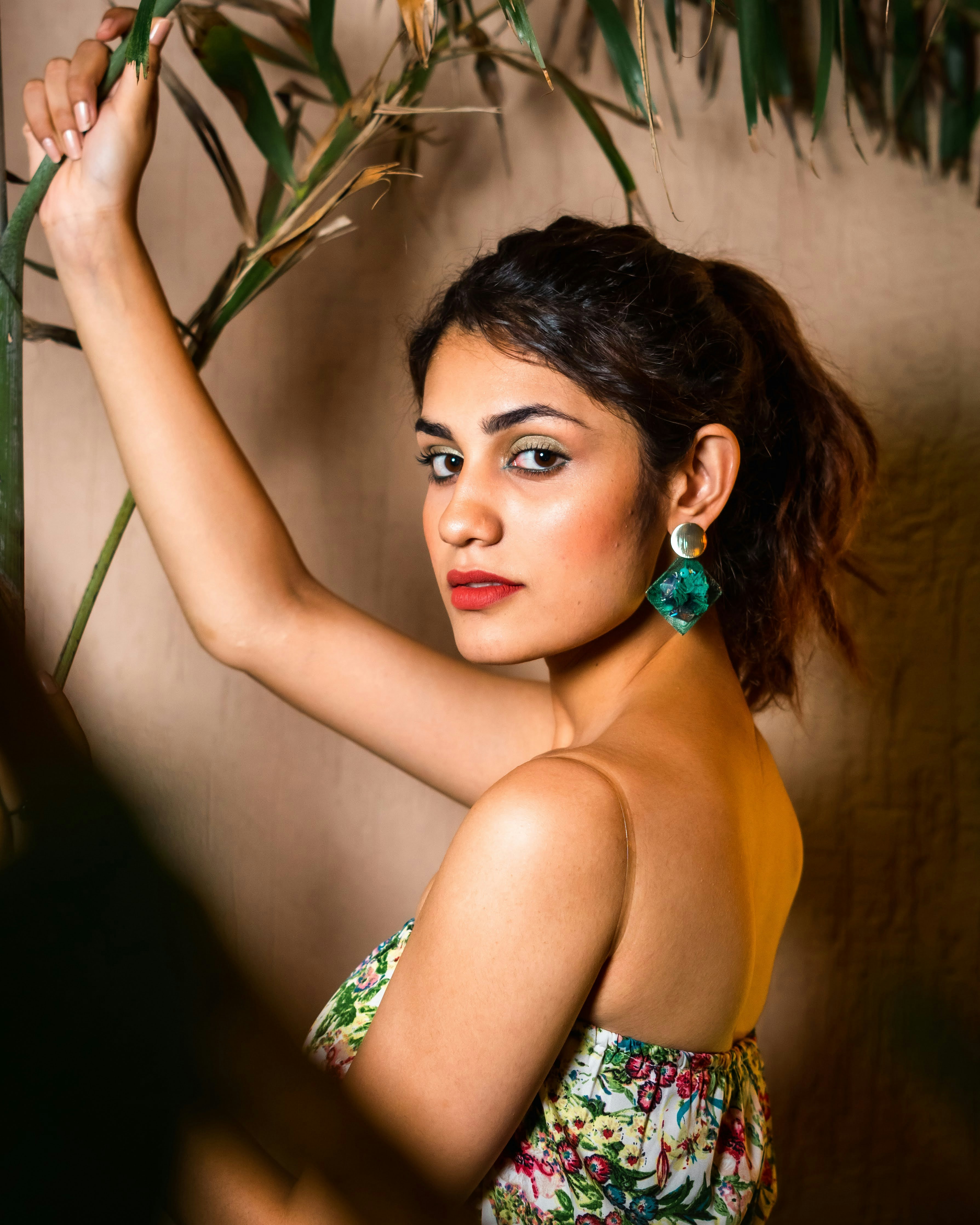 A woman in a floral dress holding a plant photo – Free Sodala Image on ...