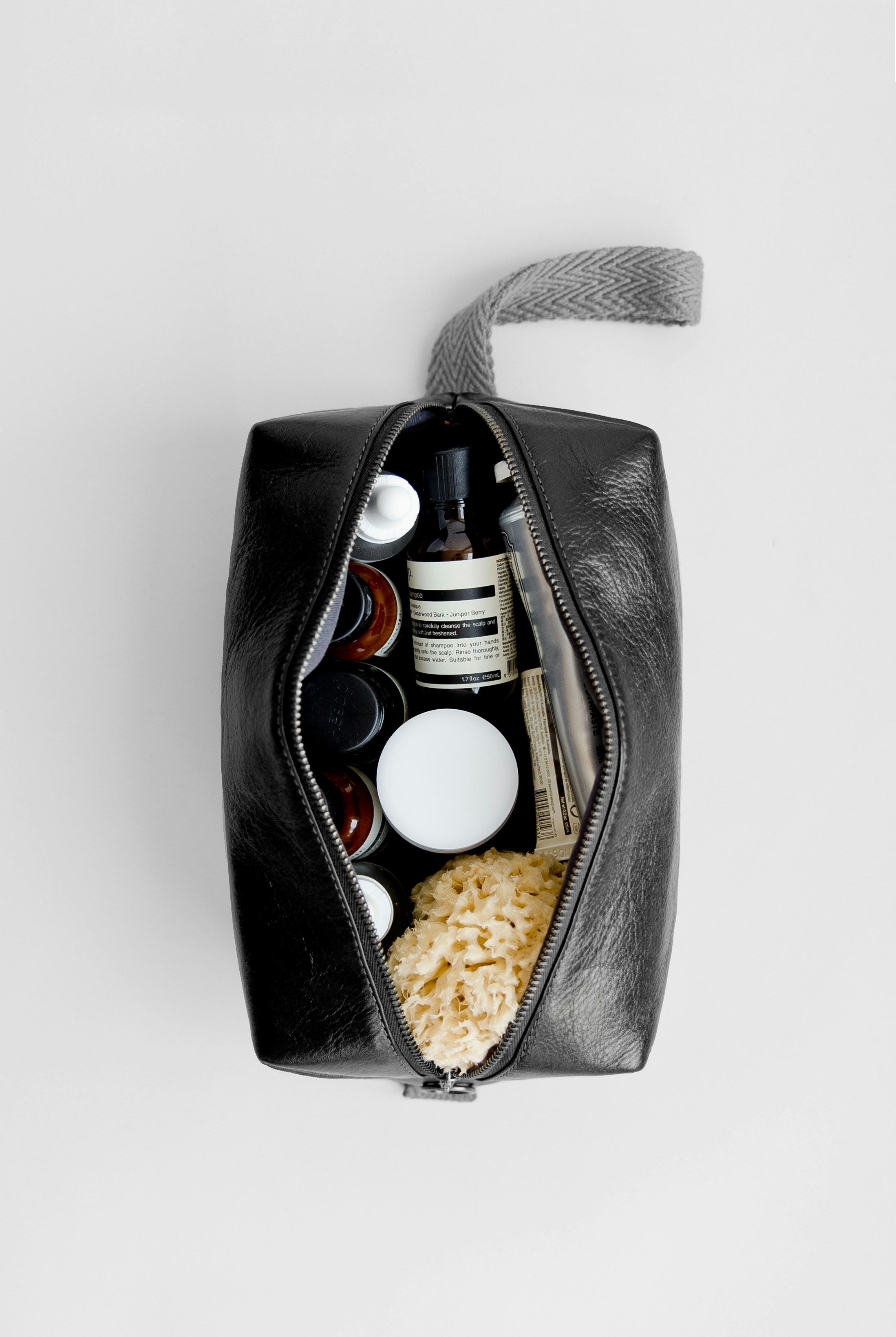 A black bag filled with lots of different items photo – Free Style ...