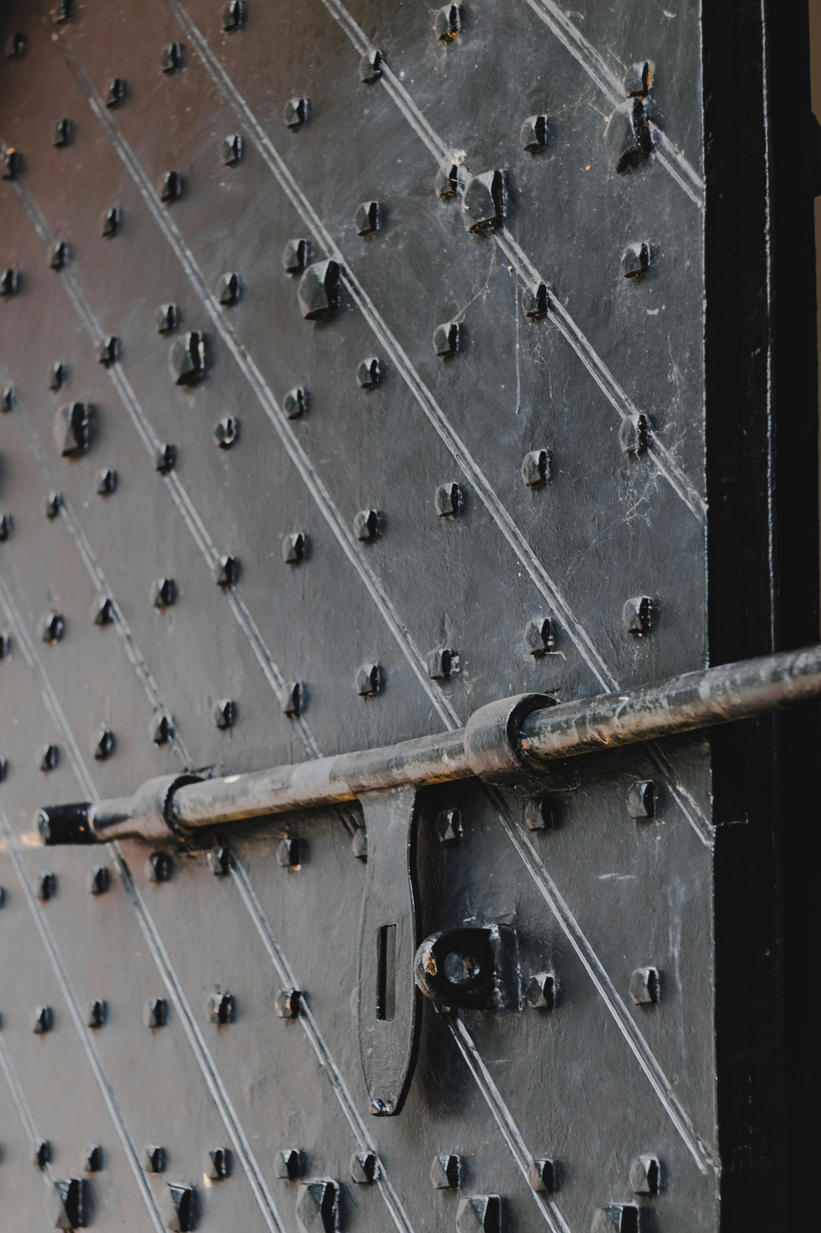 A close up of a metal door with rivets photo – Free Grey Image on Unsplash