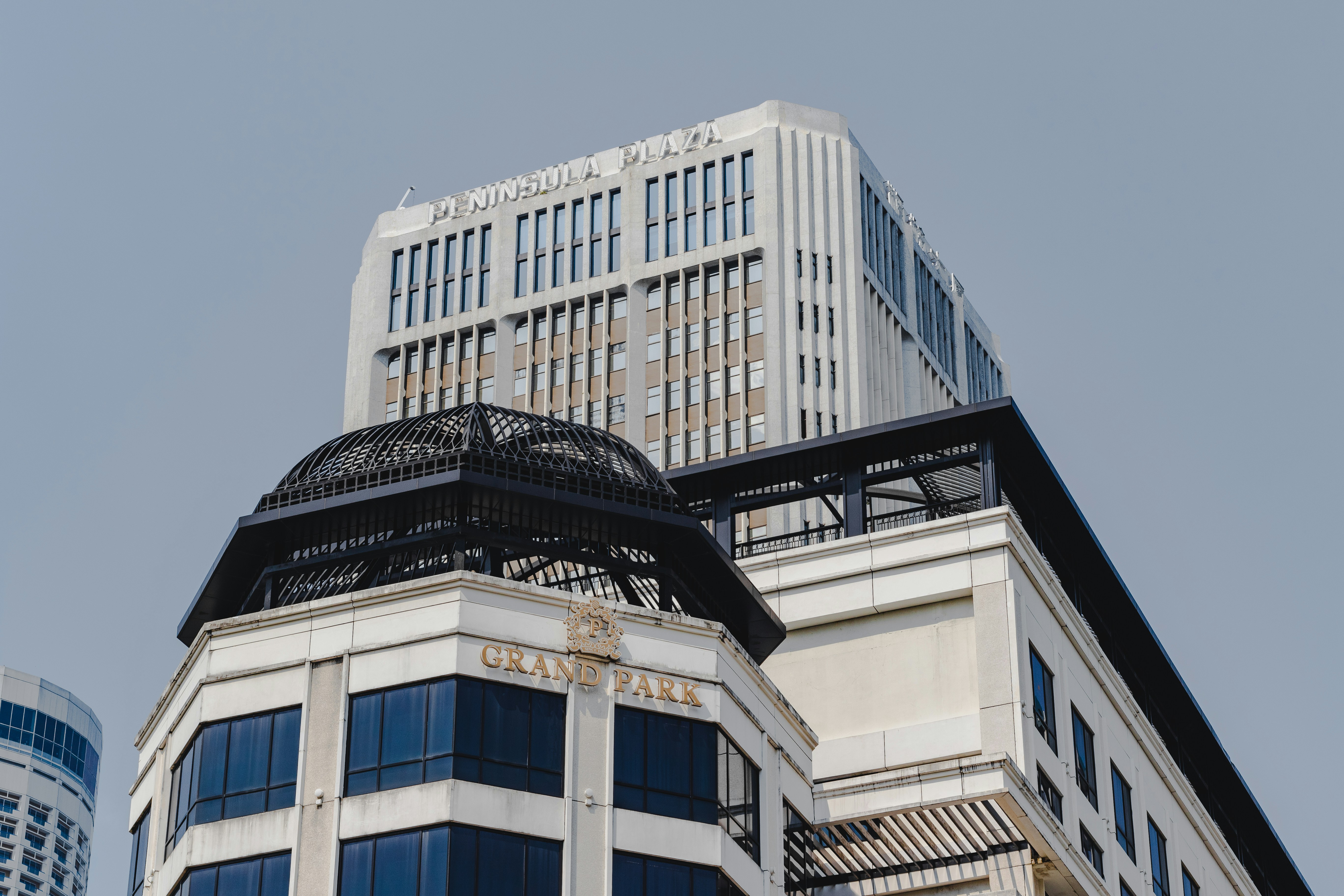 A tall building with a clock on the top of it photo – Free Singapore ...