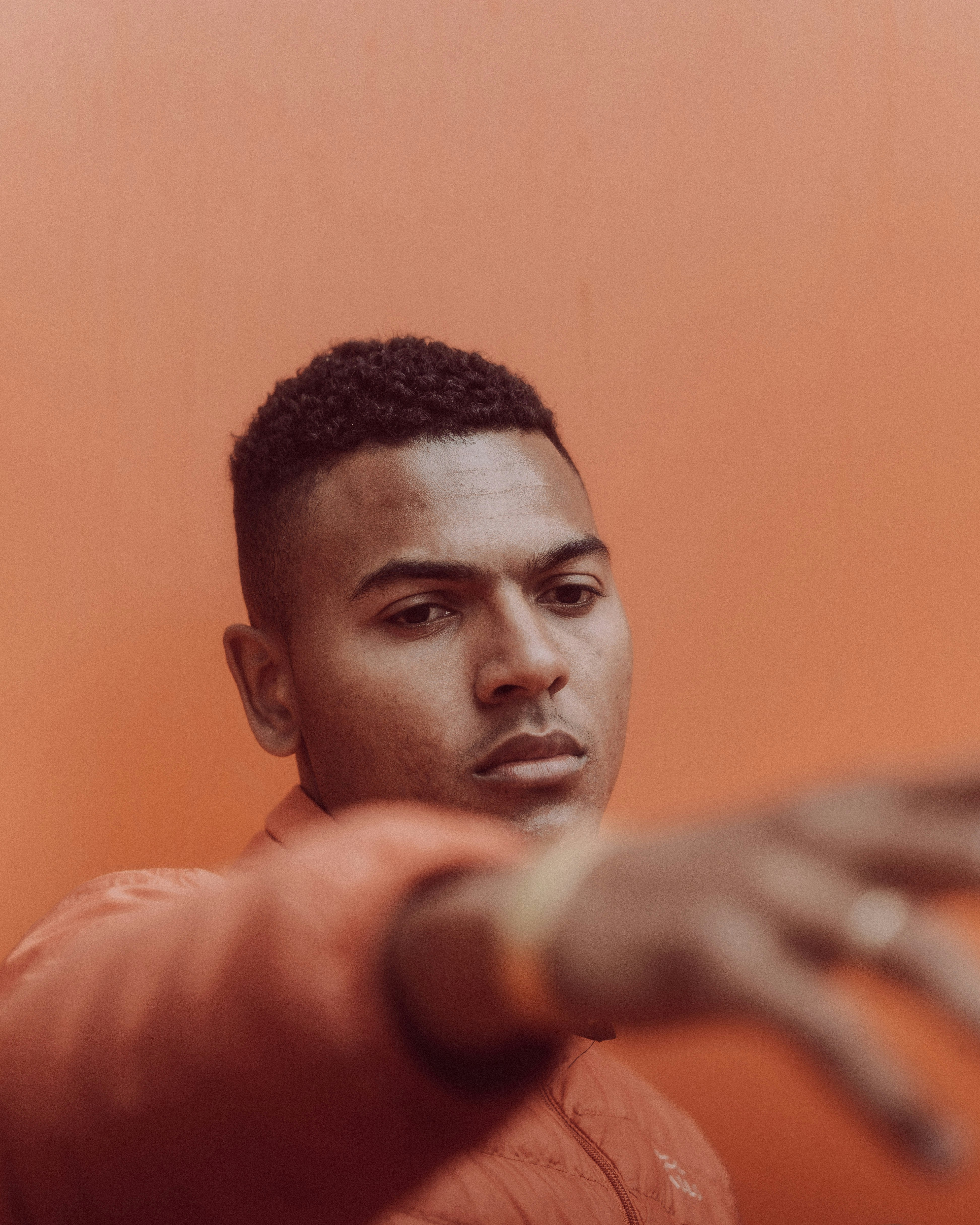 A man holding his hand out in front of him photo – Free Portrait Image ...