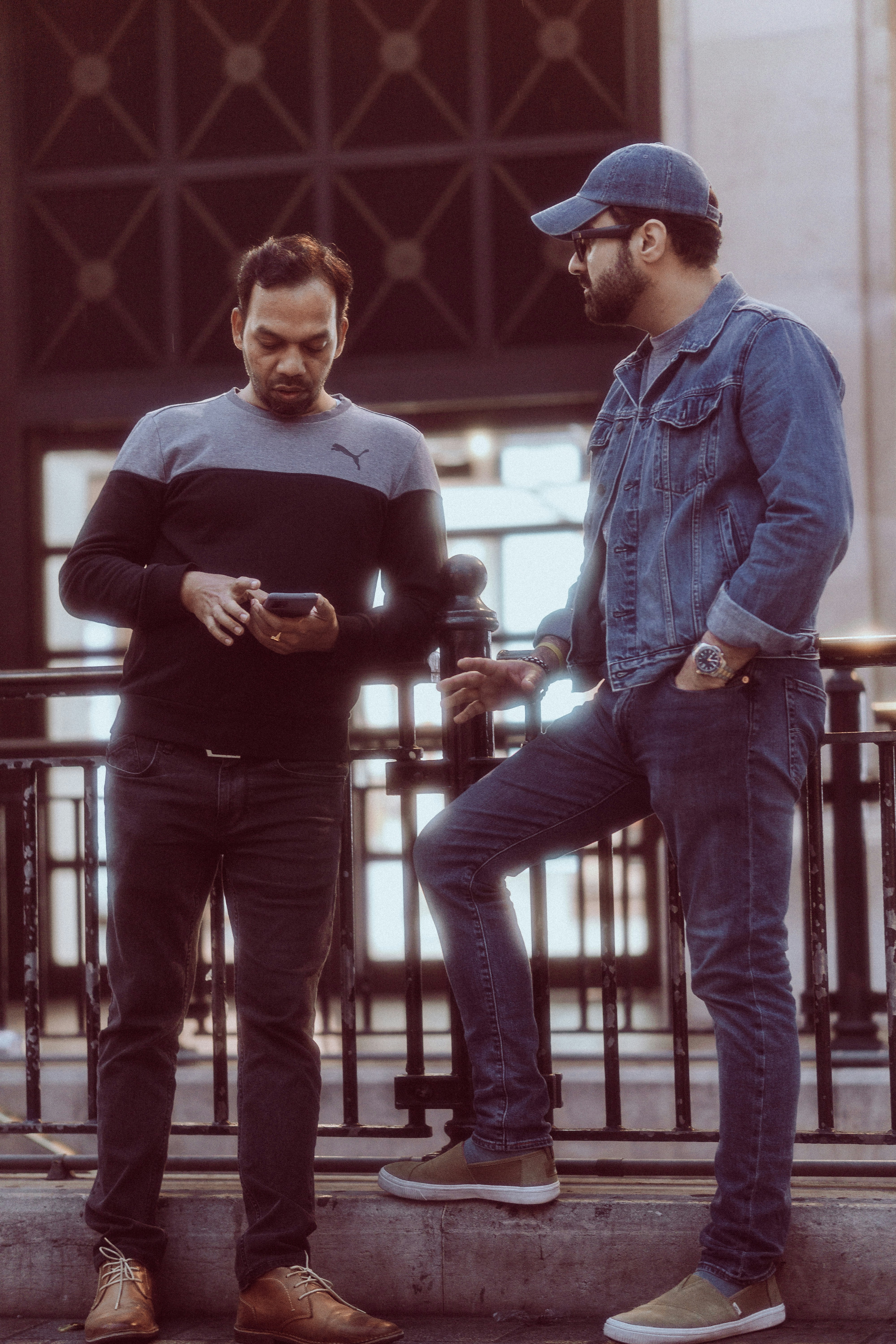 Denim at Dusk: A Quiet Moment by the Rail