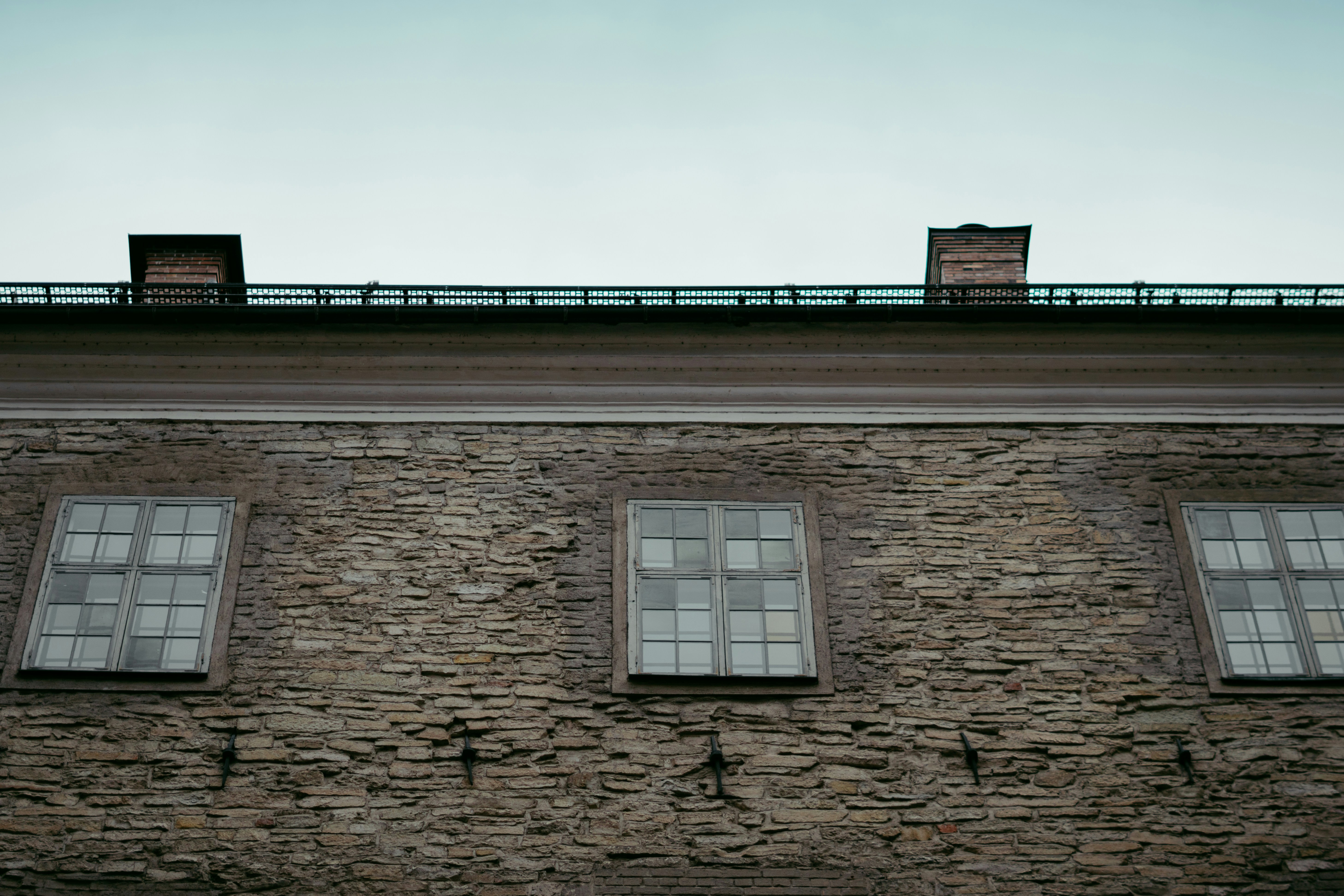 Centered Window, Weathered Brickwork: A Quiet Study in Architectural Symmetry