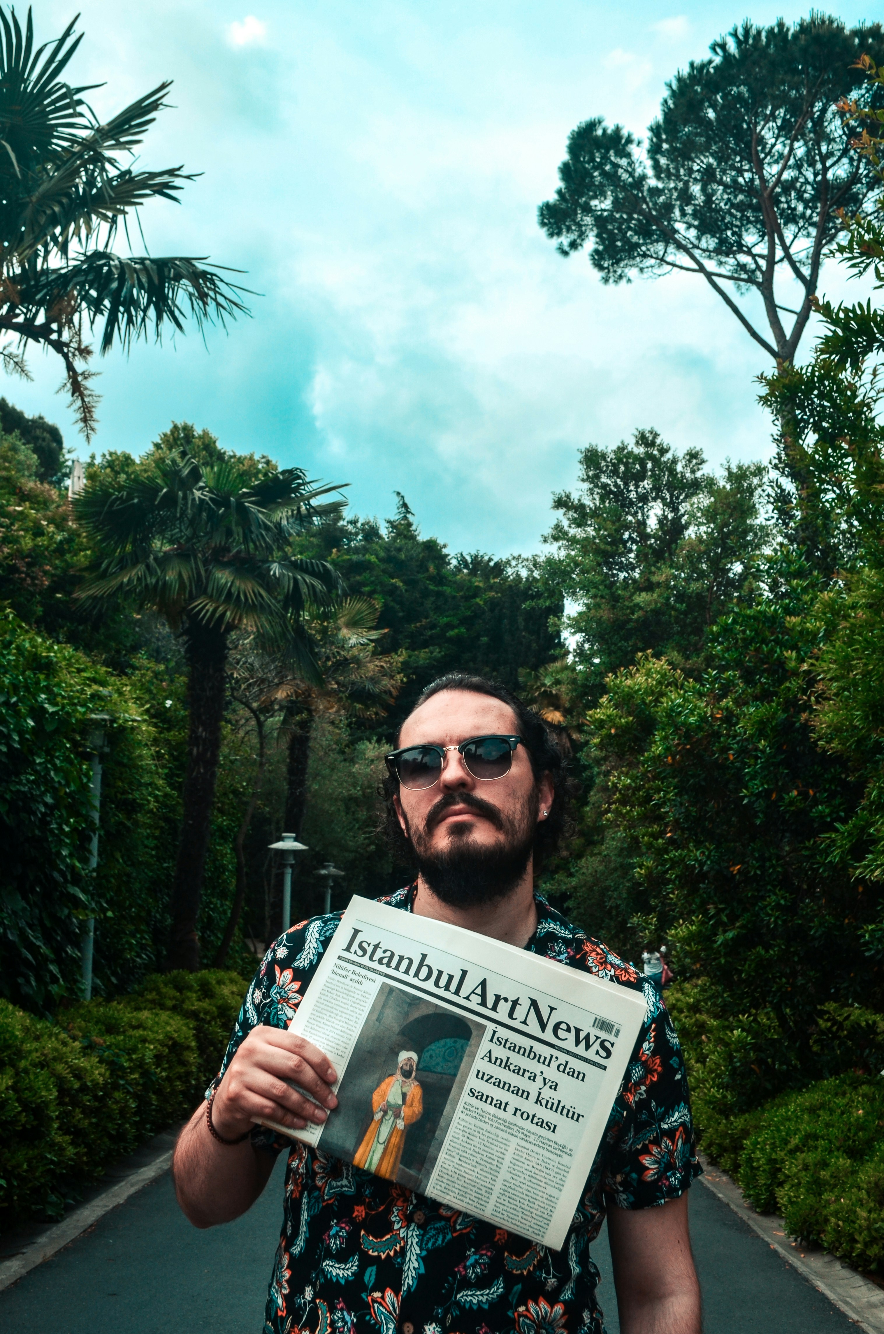 Palm-Shaded Portrait: Istanbul Art News on a Garden Path