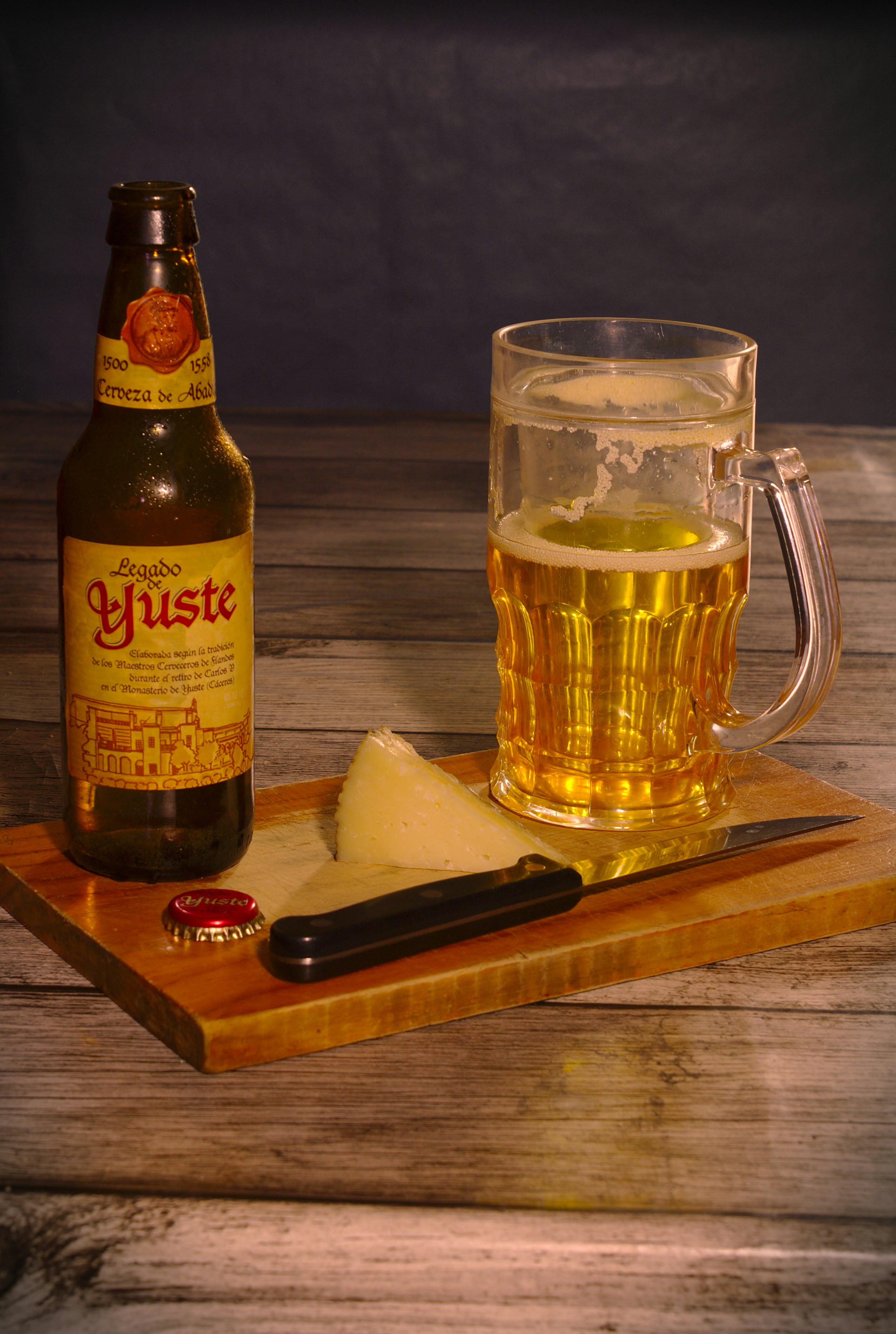 Amber Glass, Cheese, and Board: a Quiet Still-Life of Craft Beer