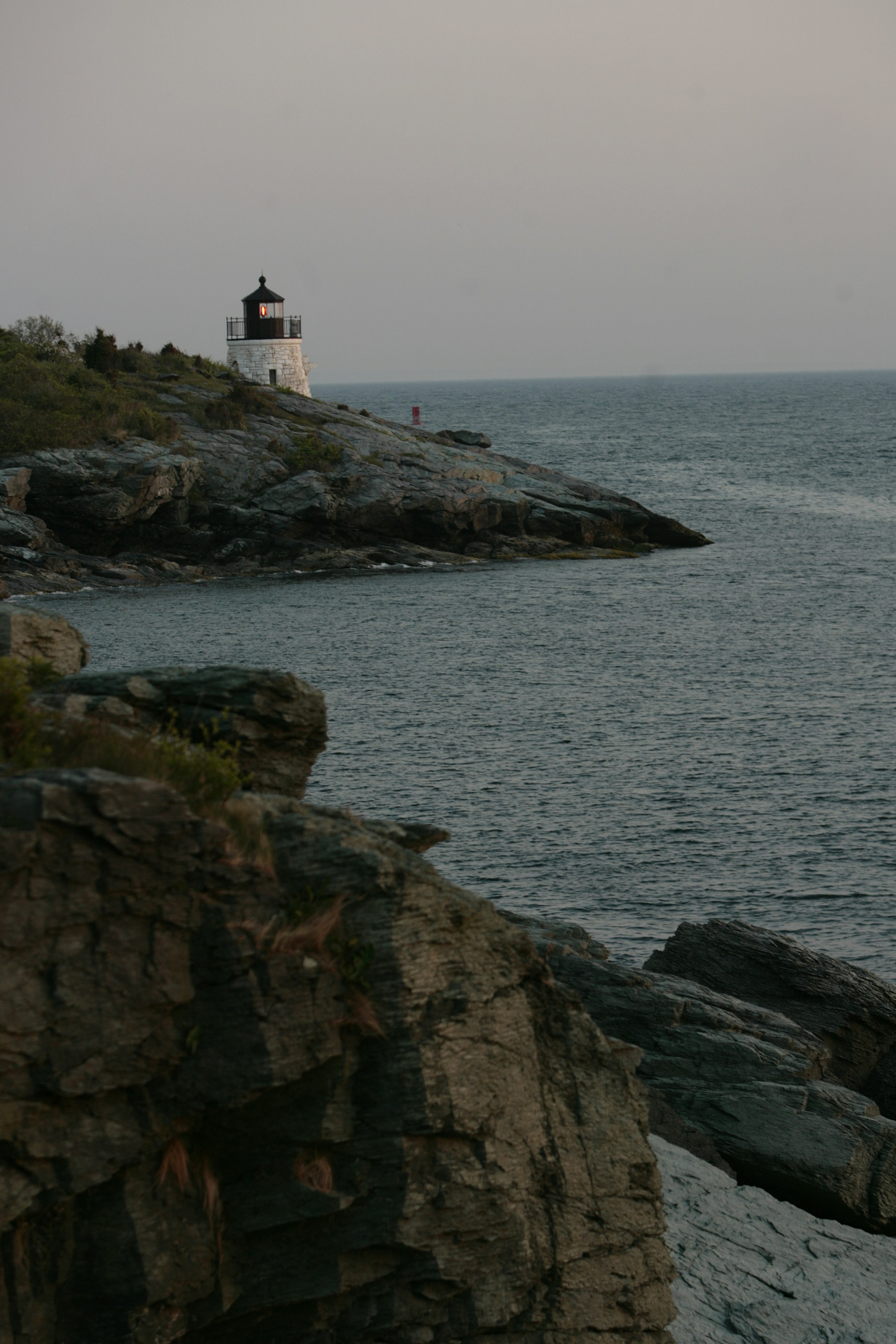 A lighthouse on a rocky cliff photo – Free Lighthouses Image on Unsplash